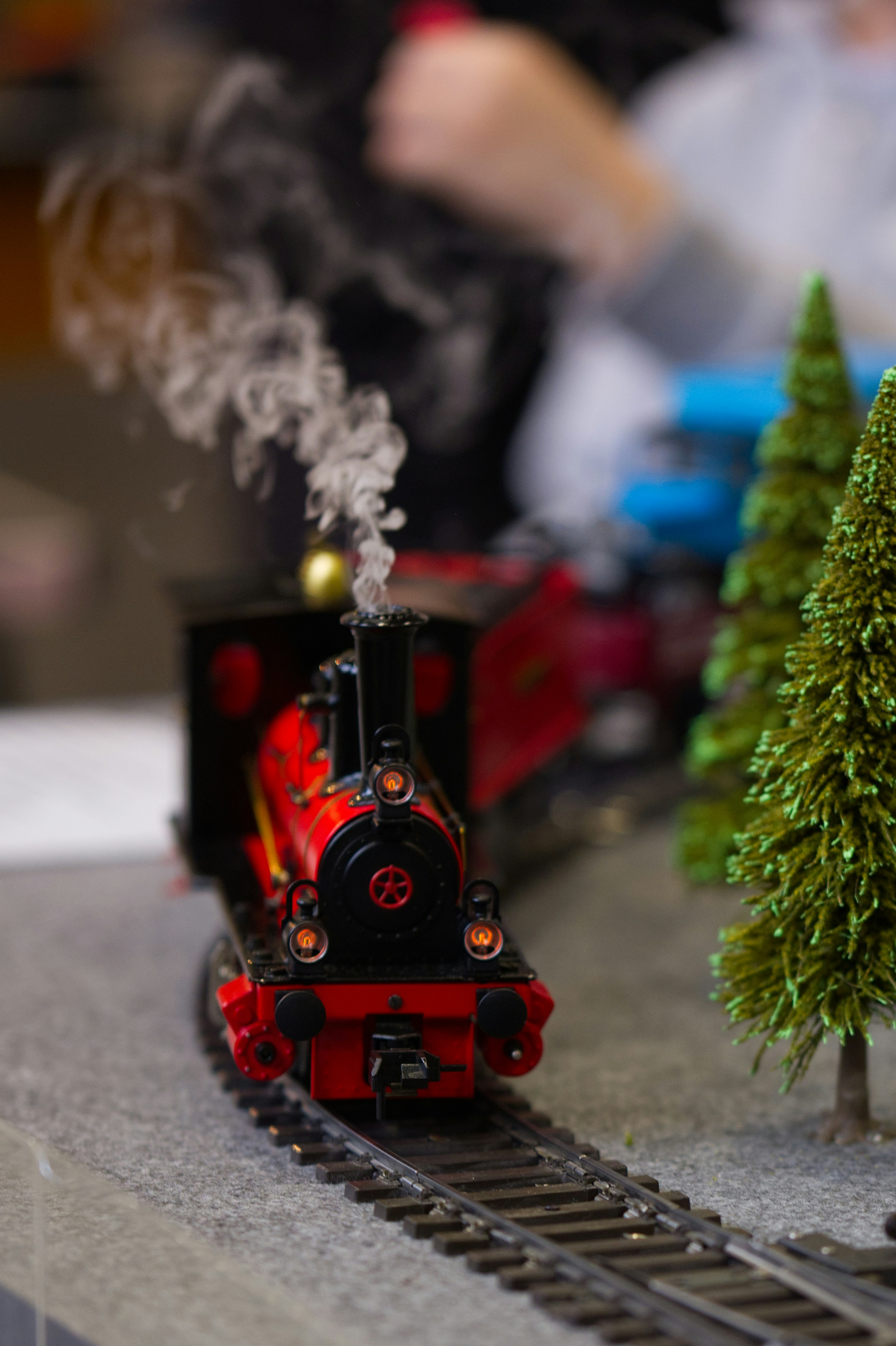 Crimson Steam on a Miniature Snow-Dusted Track