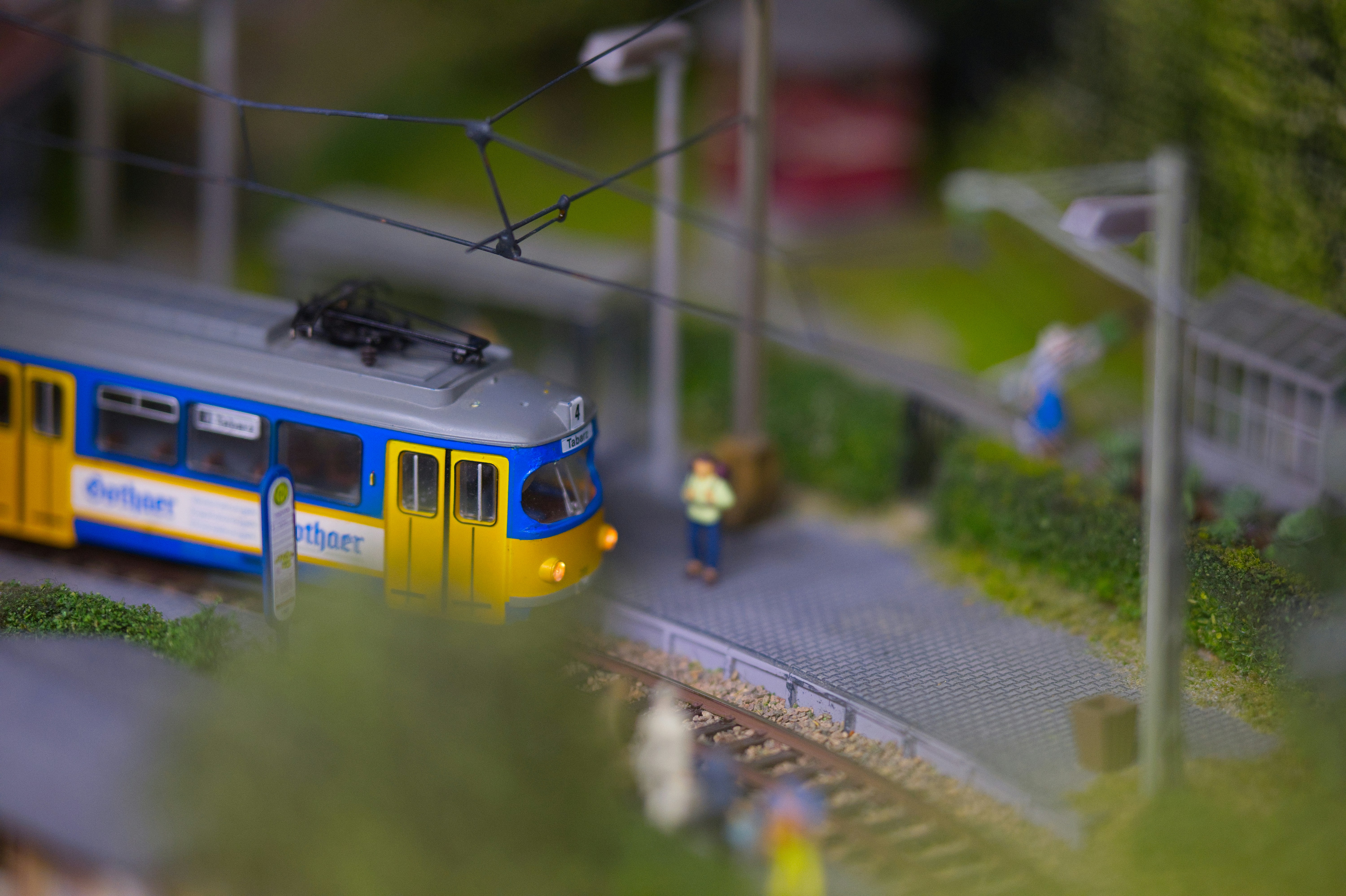 Miniature train arriving at a tiny station platform. photo – Free ...