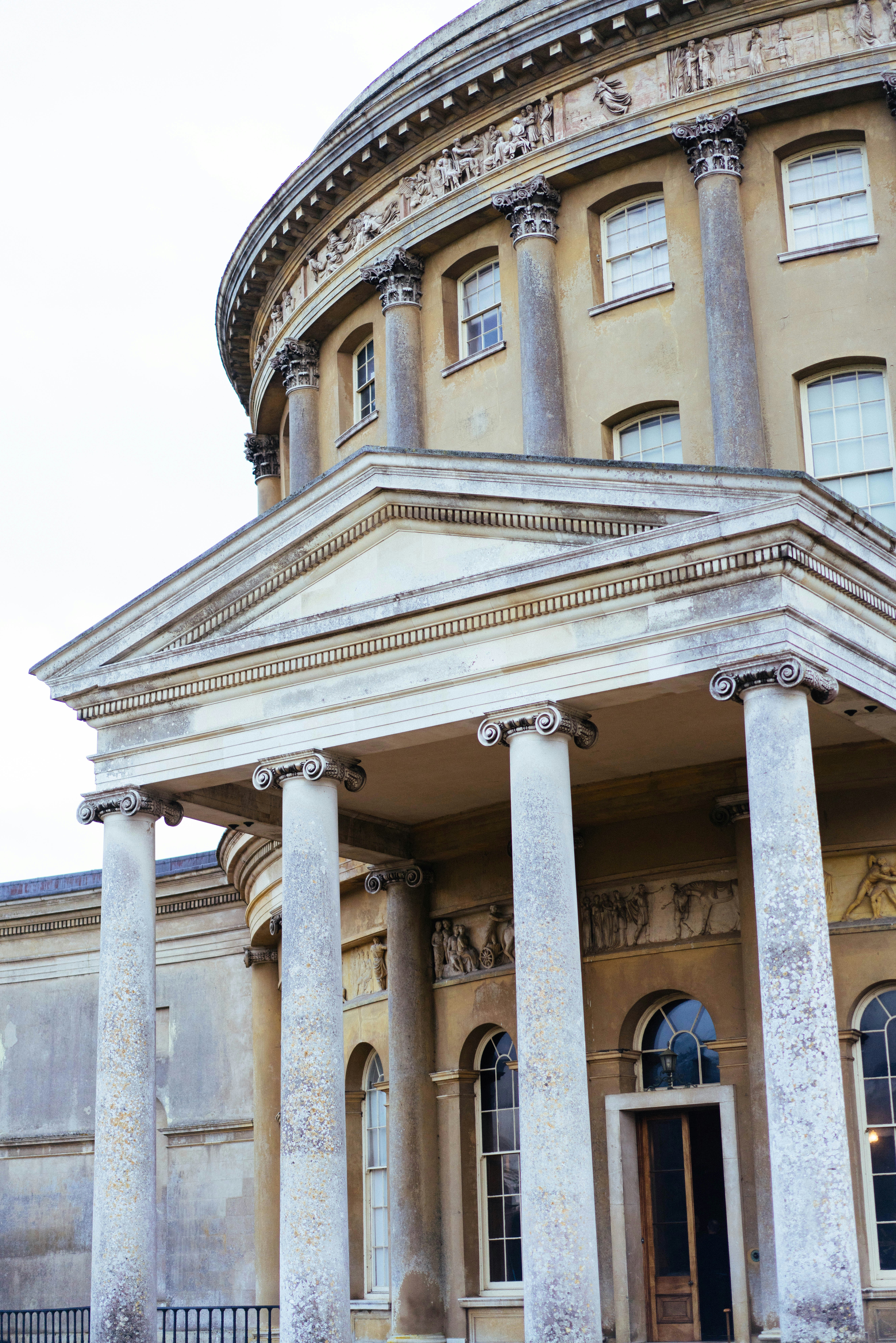 Neoclassical building with impressive columns and intricate detailing, showcasing architectural beauty and historical significance.