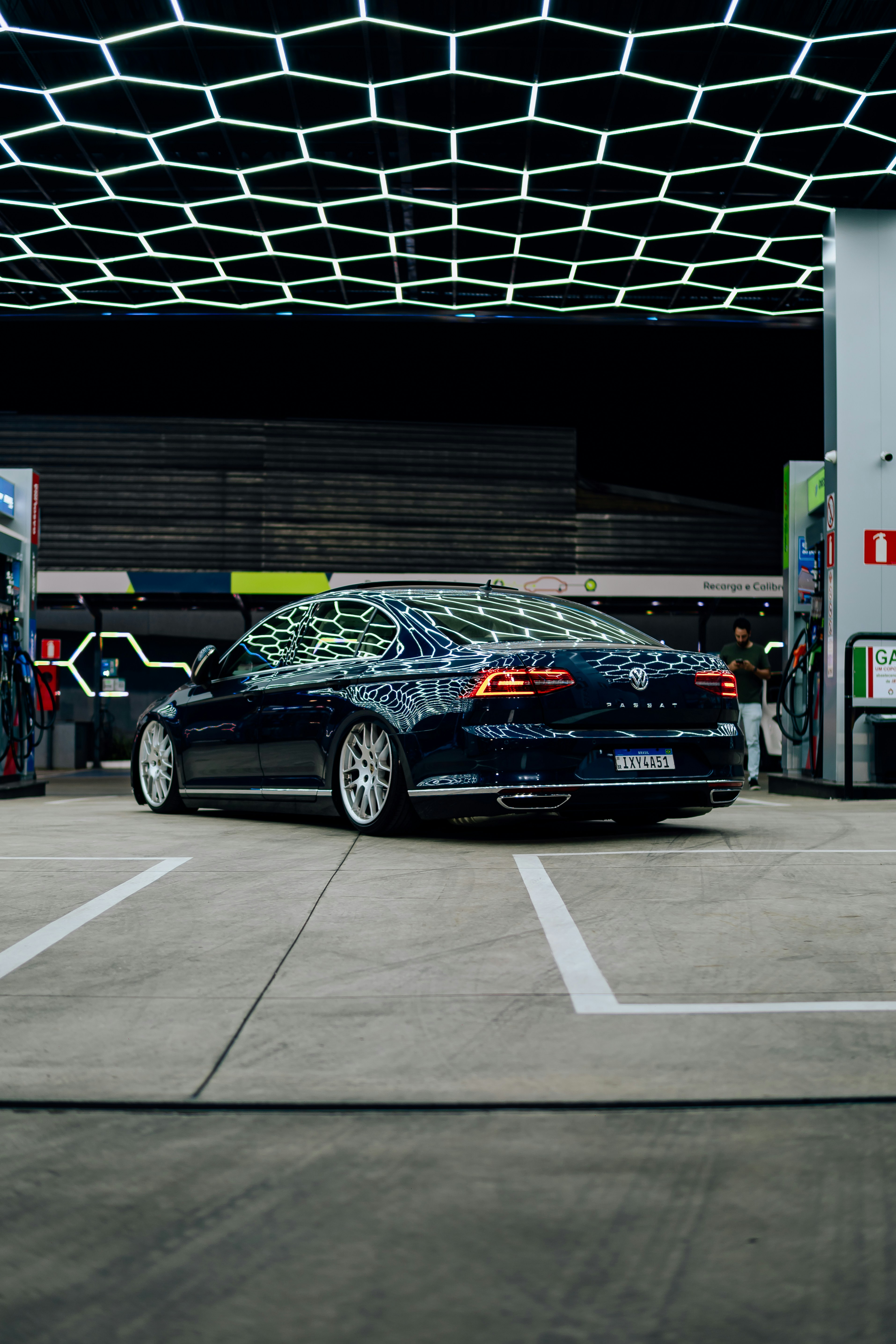 Dark sedan parked under modern hexagonal lights. photo – Free ...