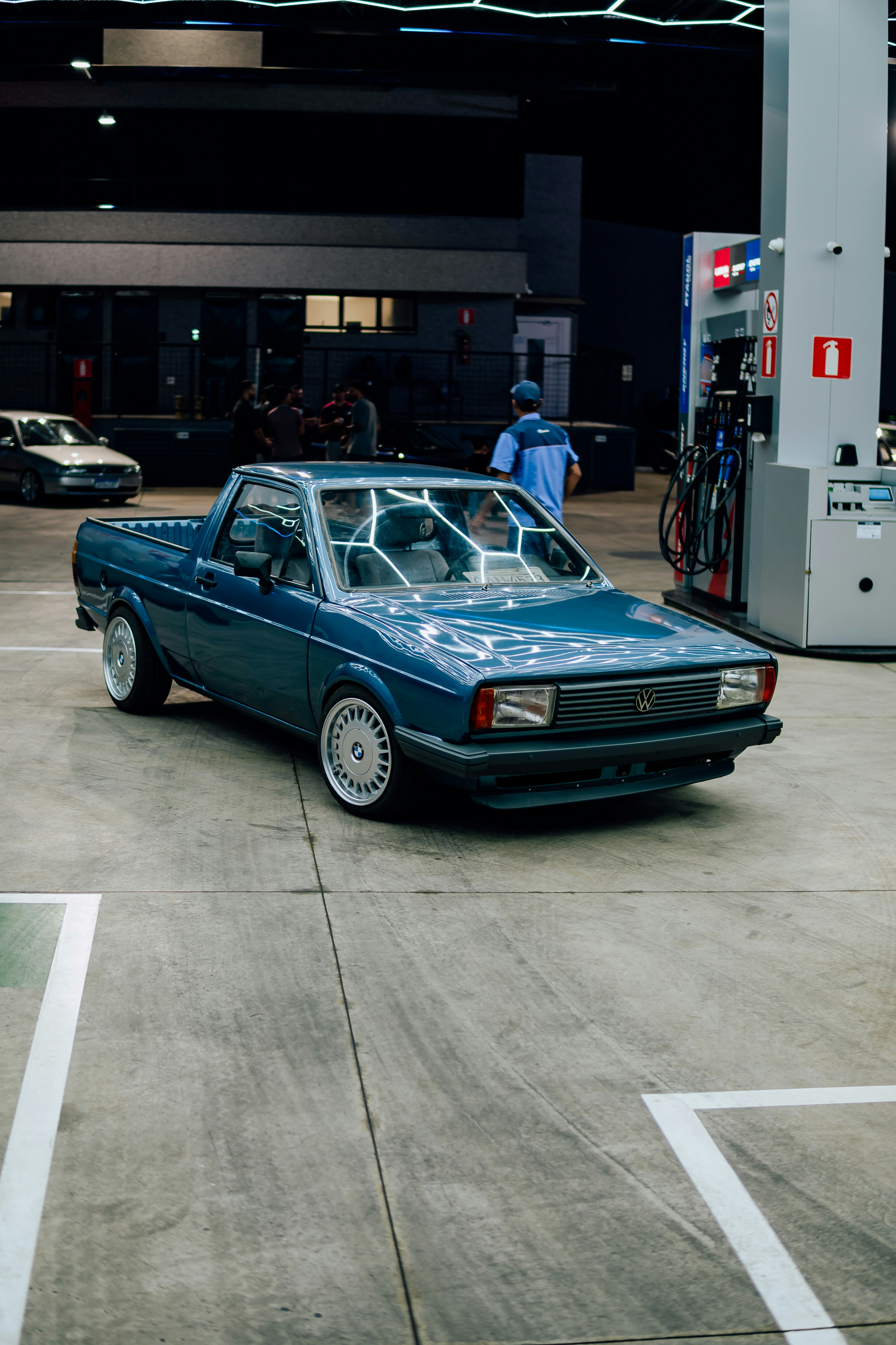 Midnight Blue Time Capsule: A Classic VW Pickup Under Indoor Showroom Light