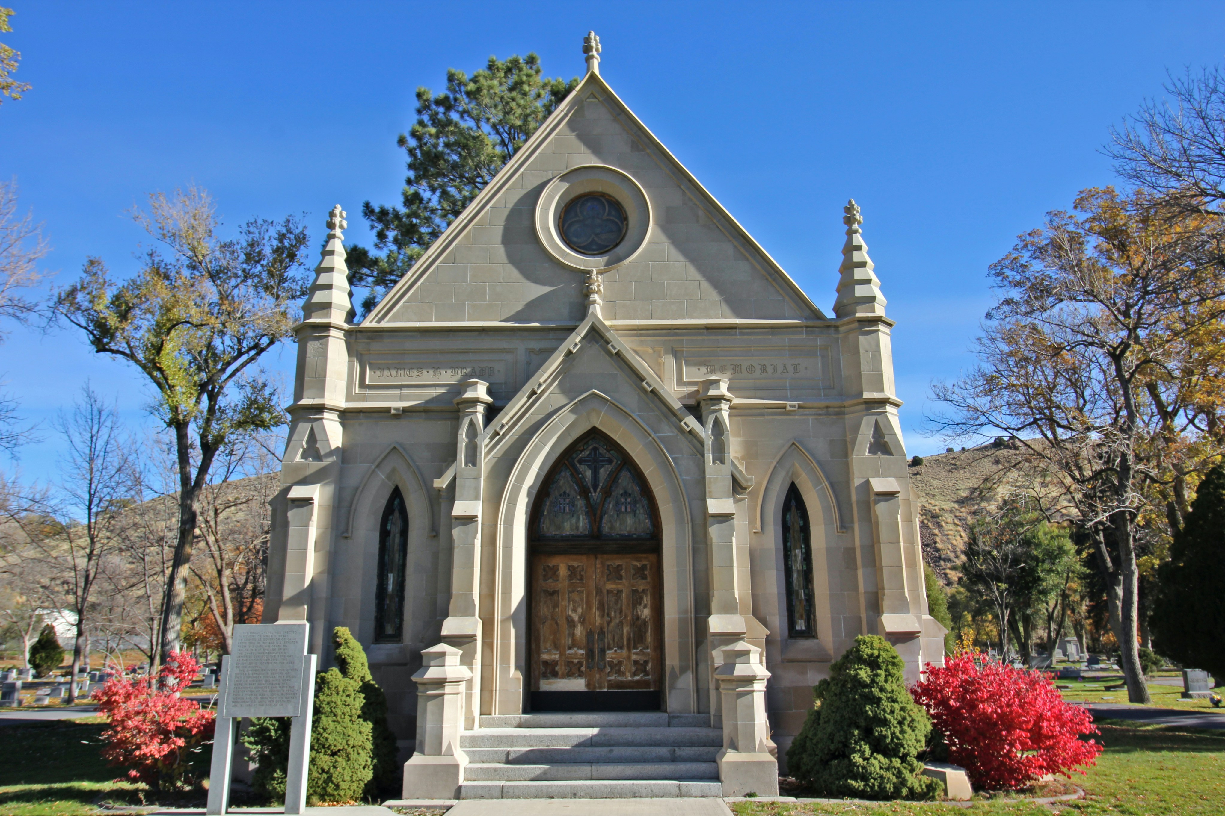 Rose-Window Gothic Chapel Standing Quietly in a Sunlit Garden