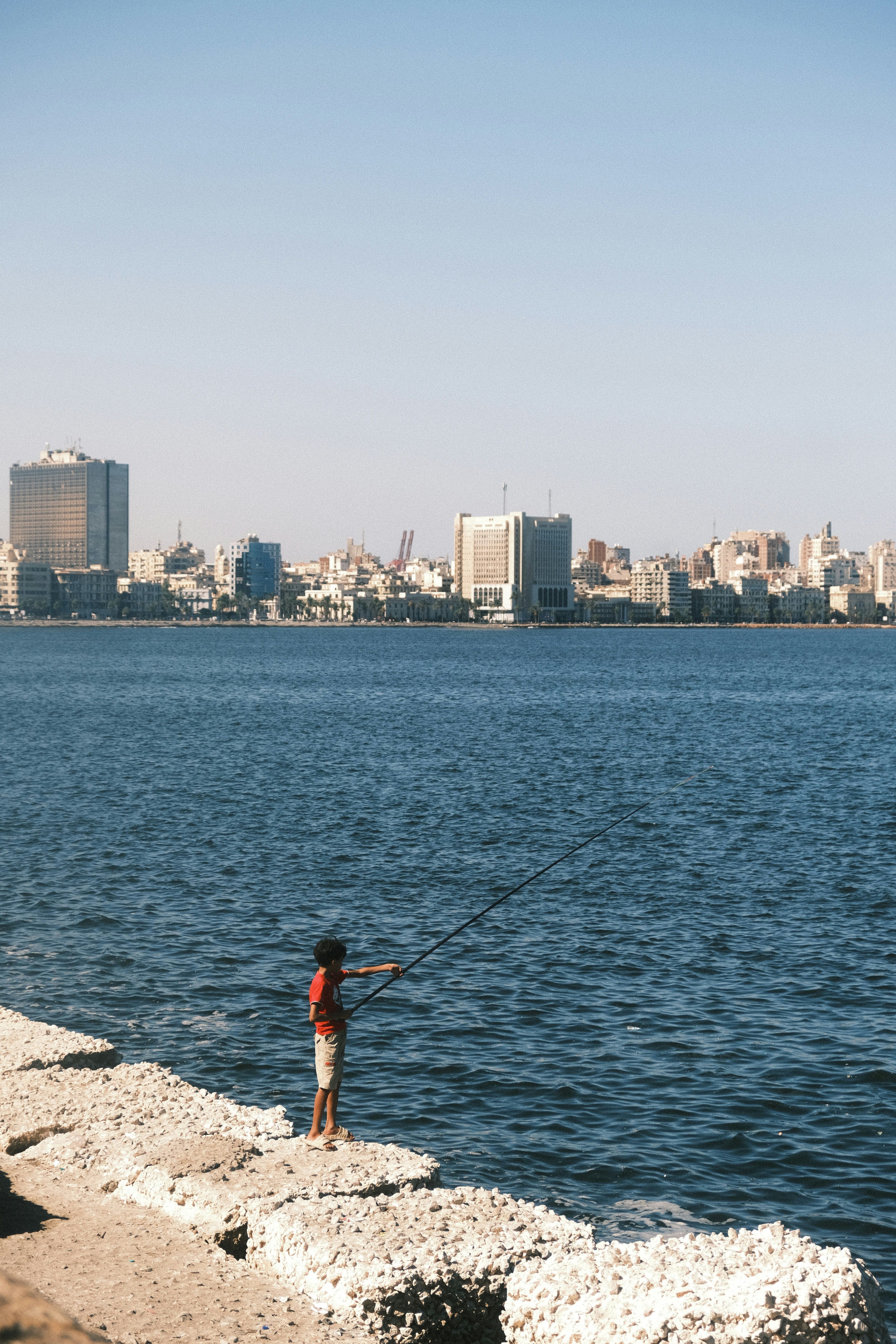 A Young Angler's Day by the Waterfront