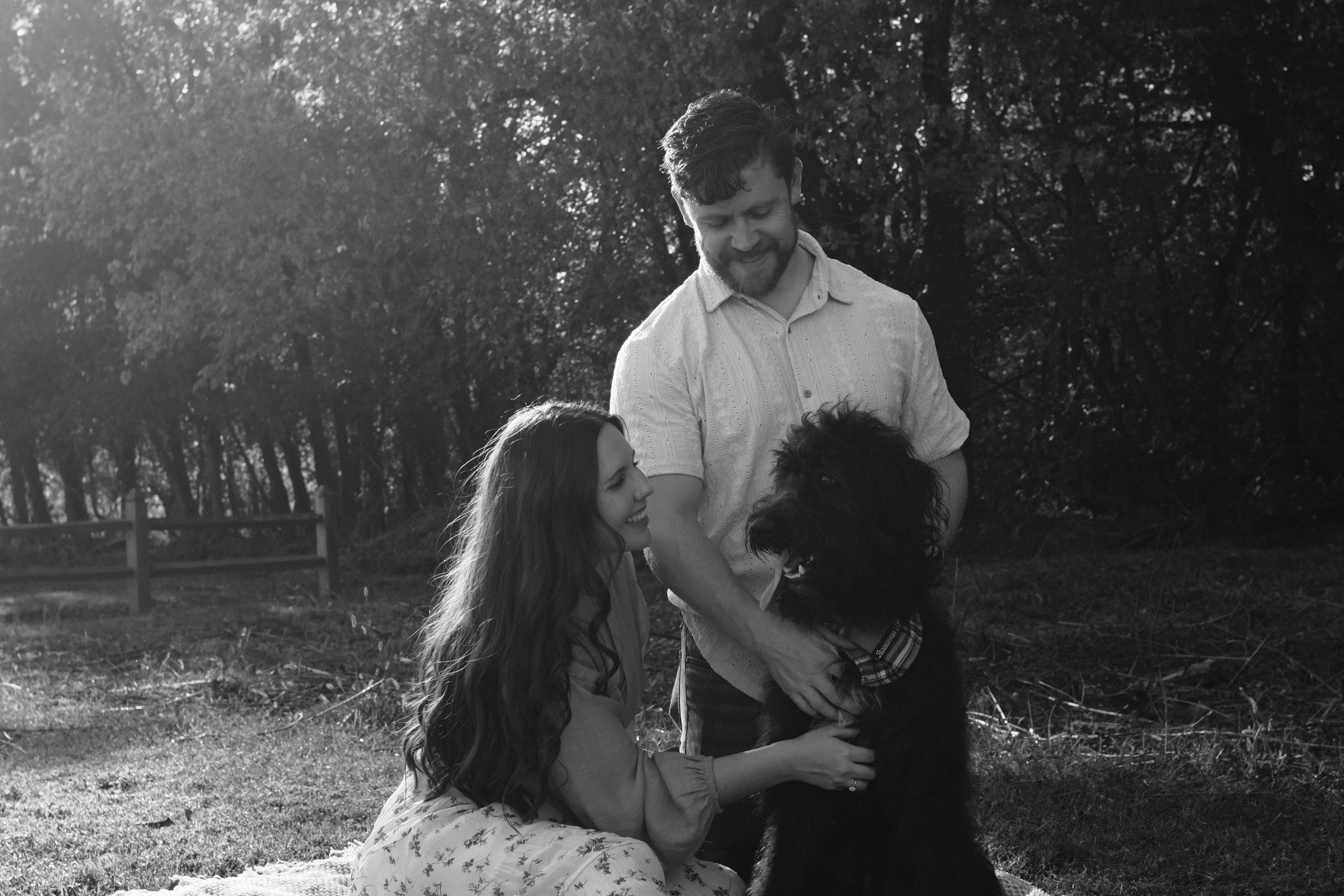 Quiet Bond in the Park: A Couple and Their Dog