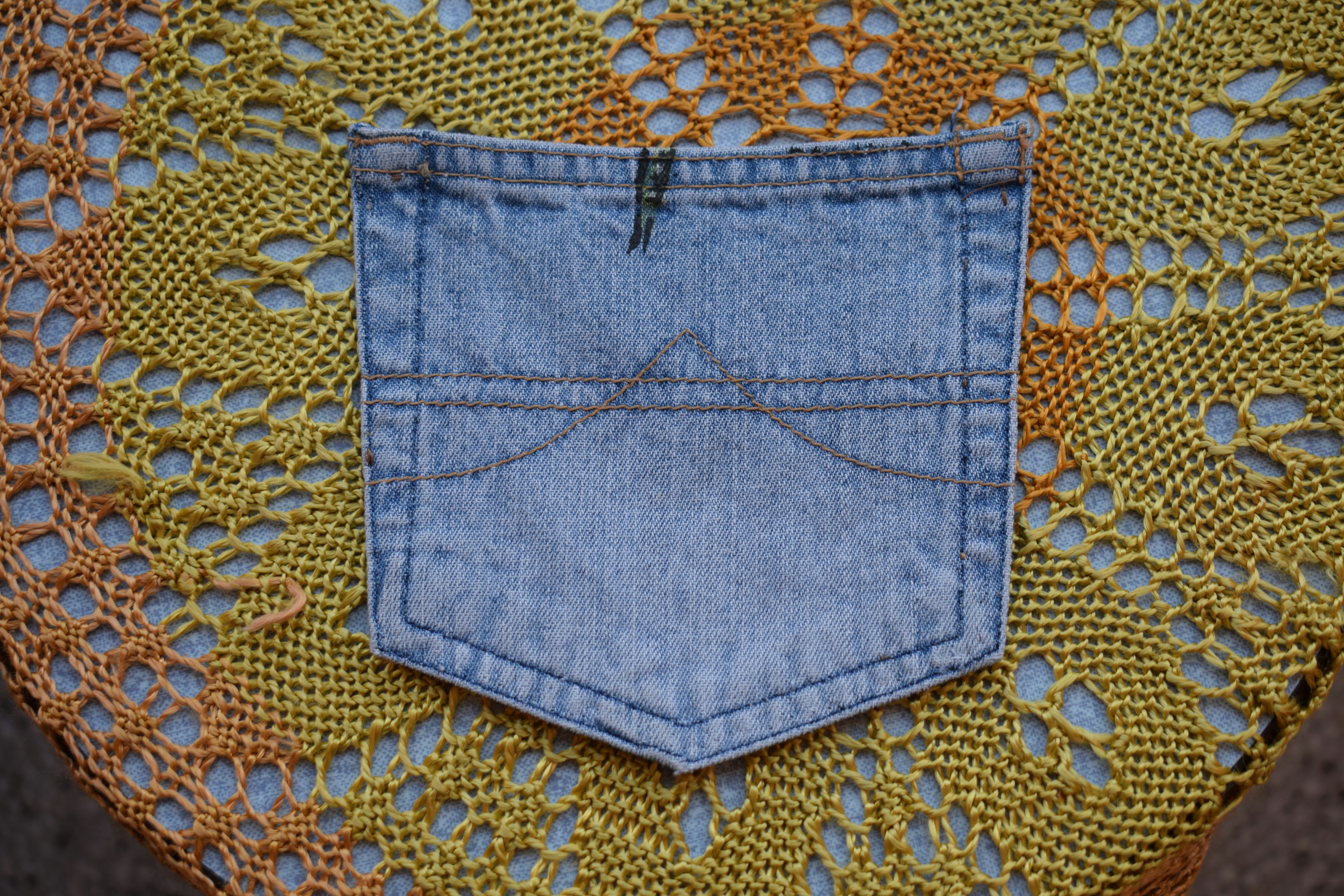 Denim Pocket on Vibrant Crochet Canvas