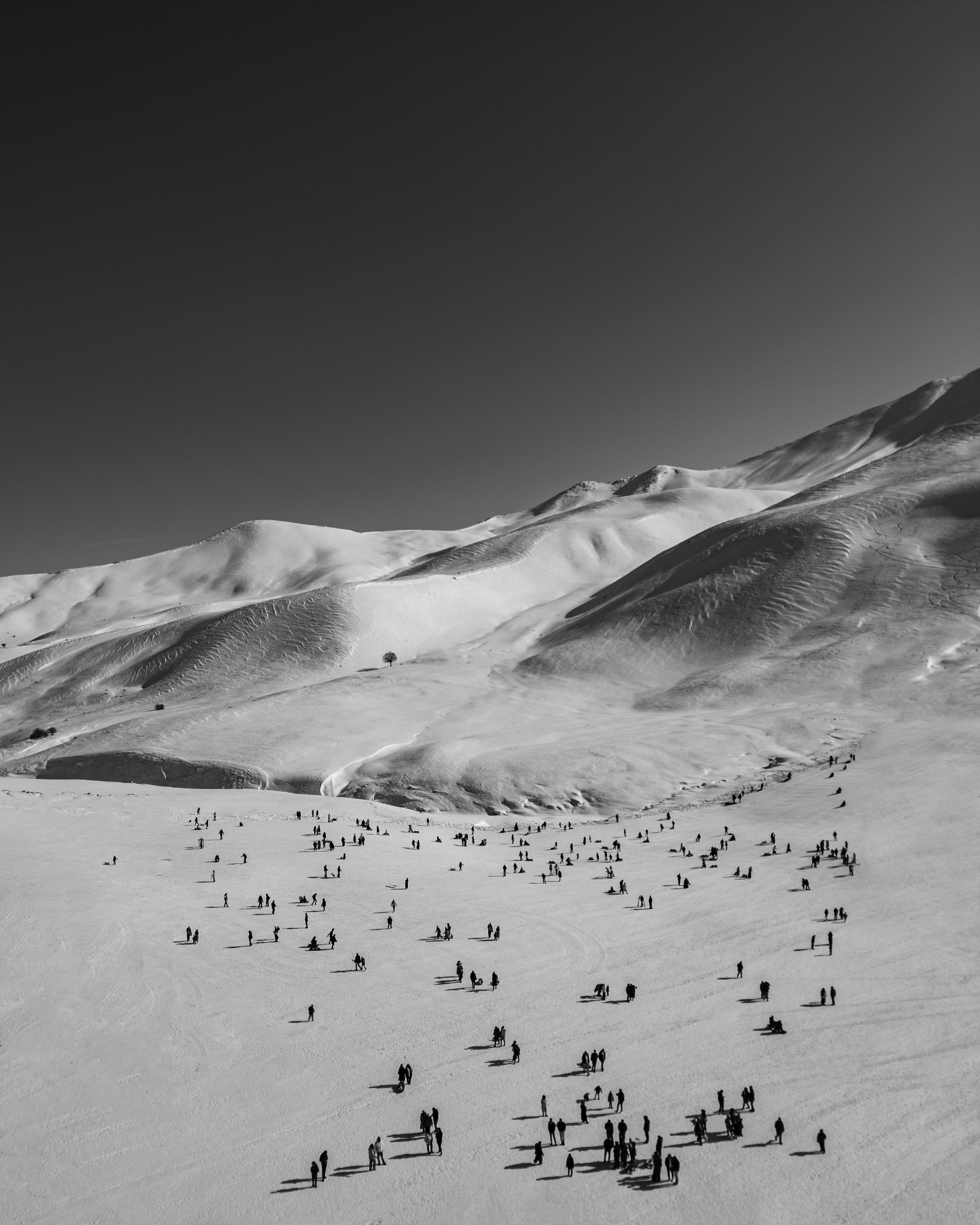Many skiers gather on a snowy mountainside. photo – Free Winter Image ...