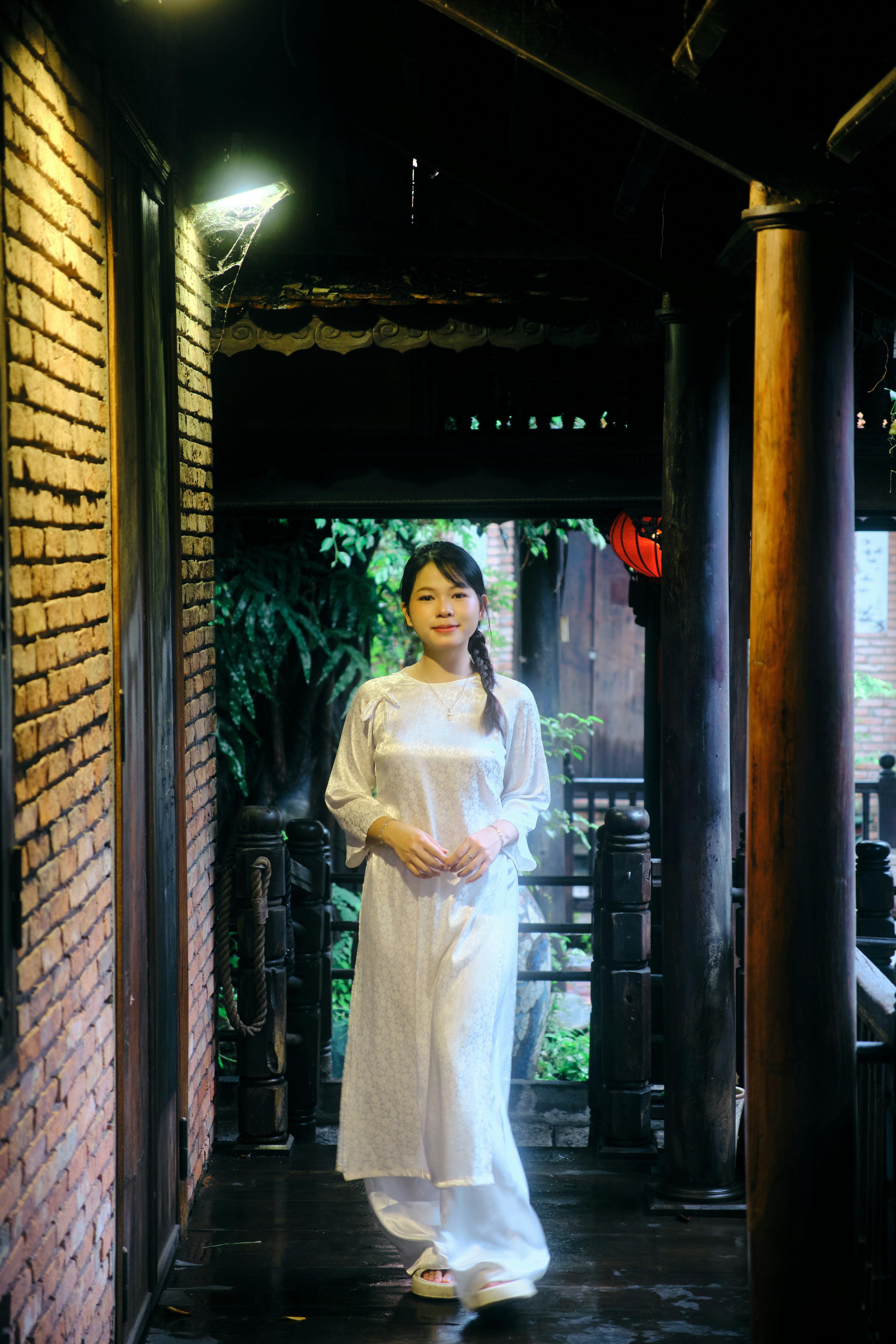 Quiet Grace in a Lantern-lit Corridor