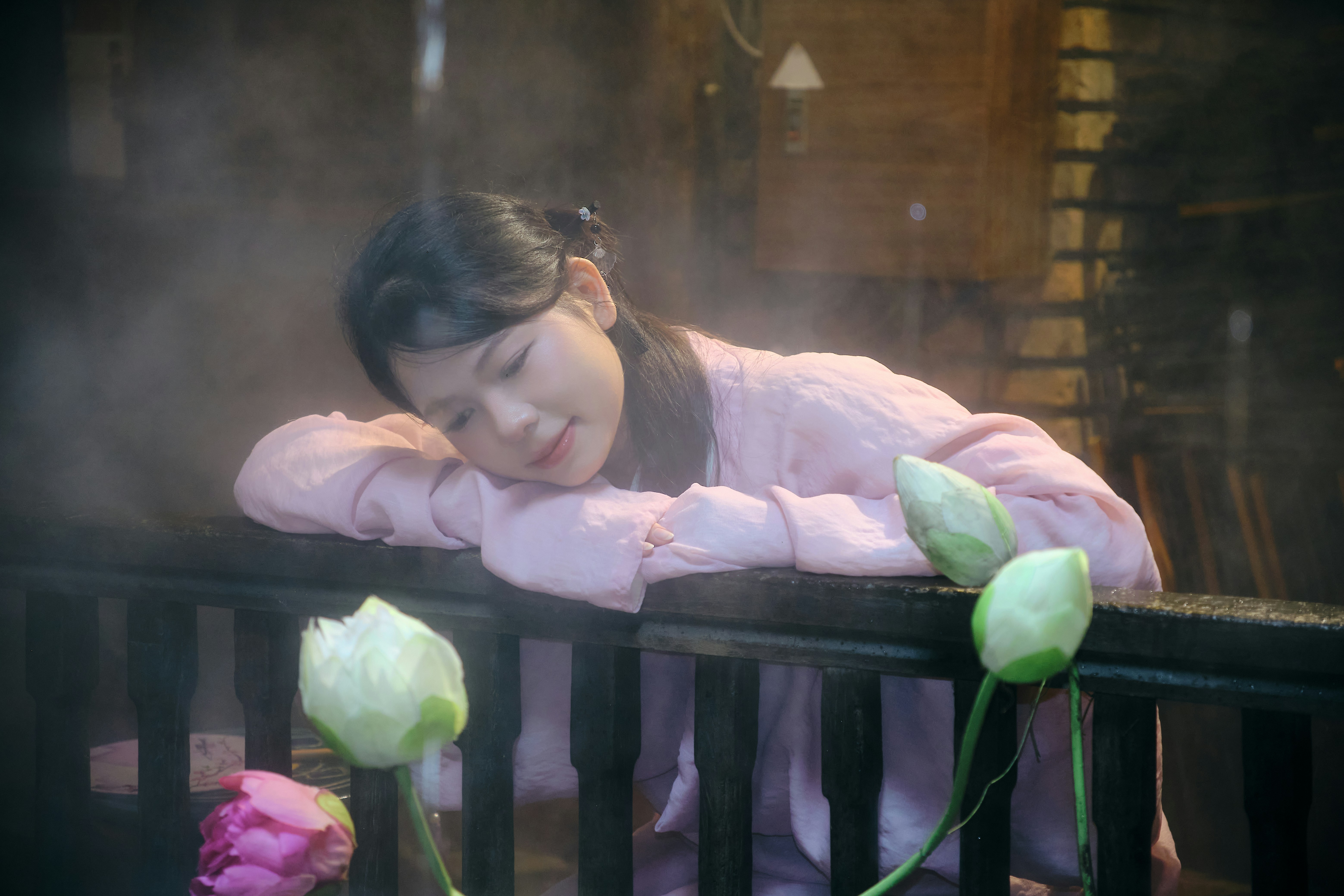 Mist in Pink: Quiet Moment by the Glass Rail with Lotus Blooms