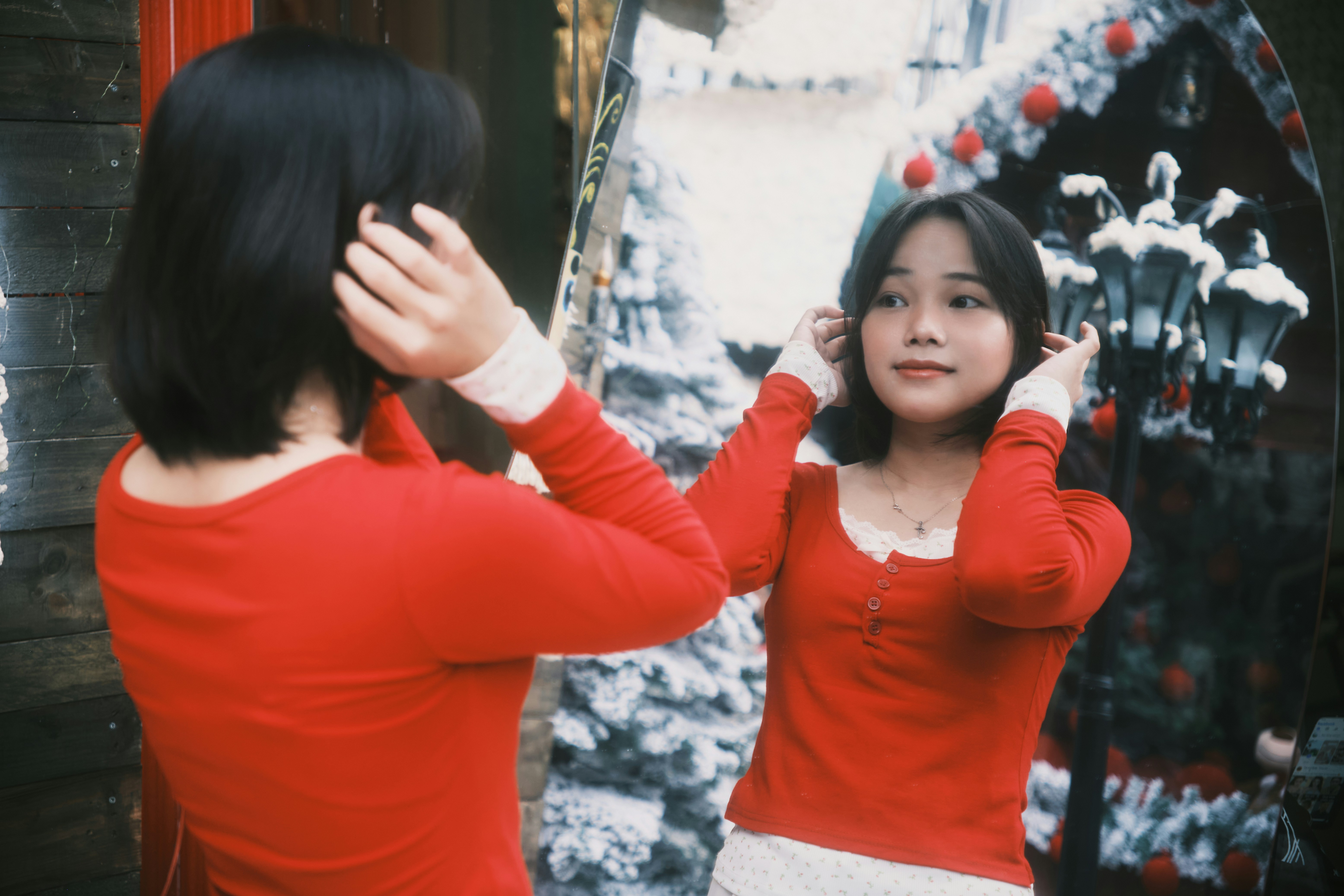 Red-Sweater Reflections: A Quiet Moment in a Festive Mirror