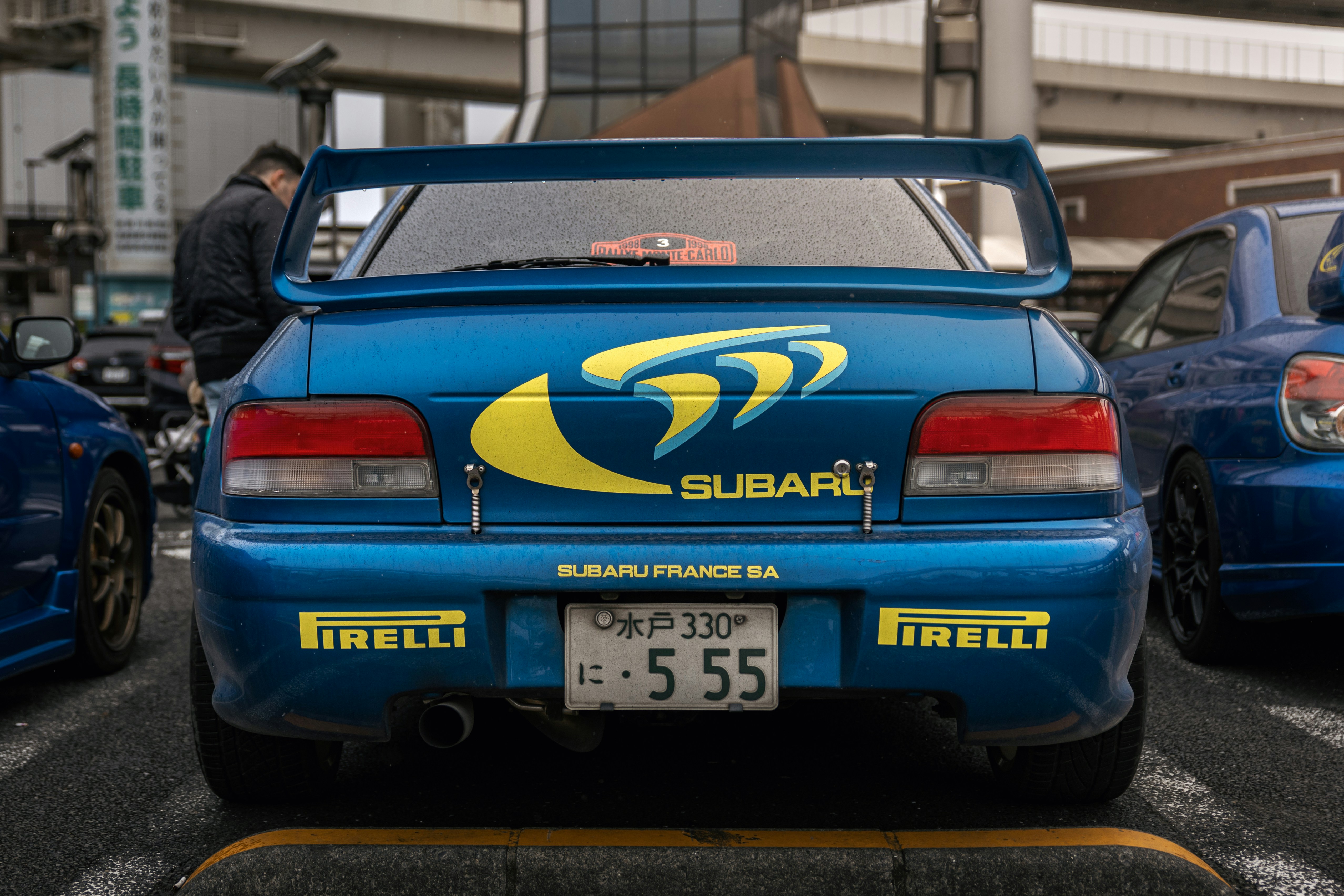 Winged in the City: The Blue Subaru's Bold Rear Stance