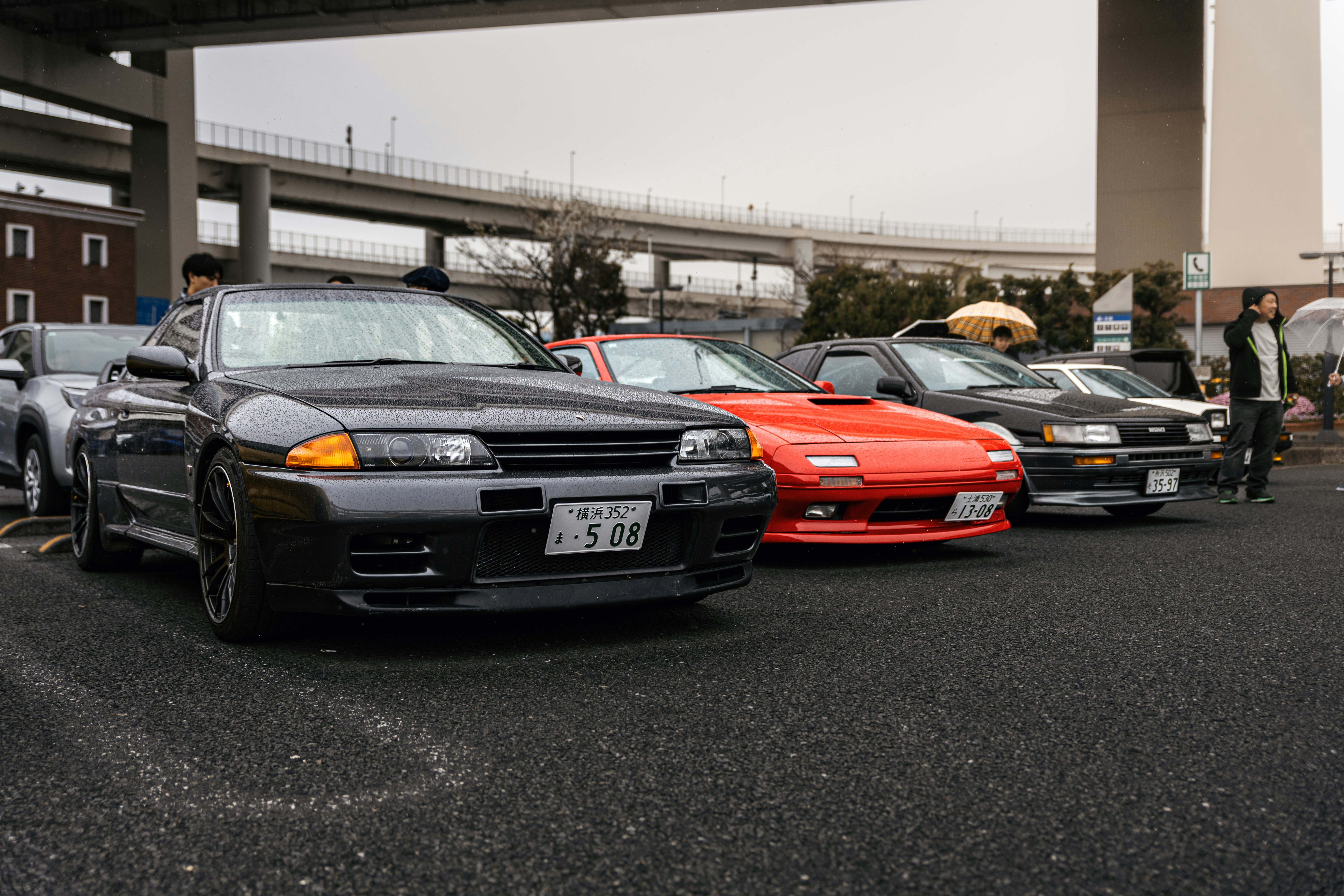 Several sports cars parked in a line photo – Free Sports car Image on ...