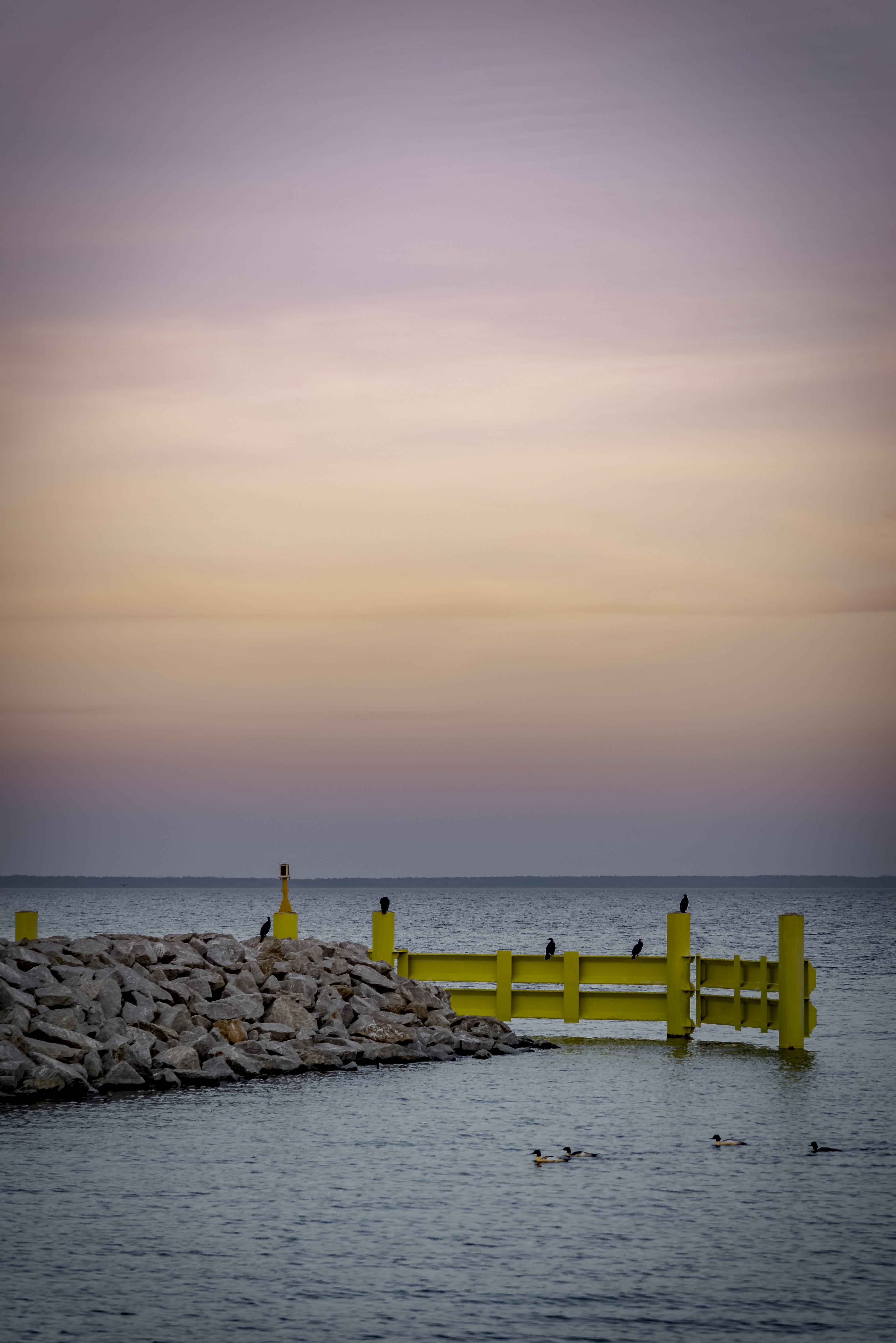 Dusk on the Yellow Jetty: Soft Pastels and Quiet Waves