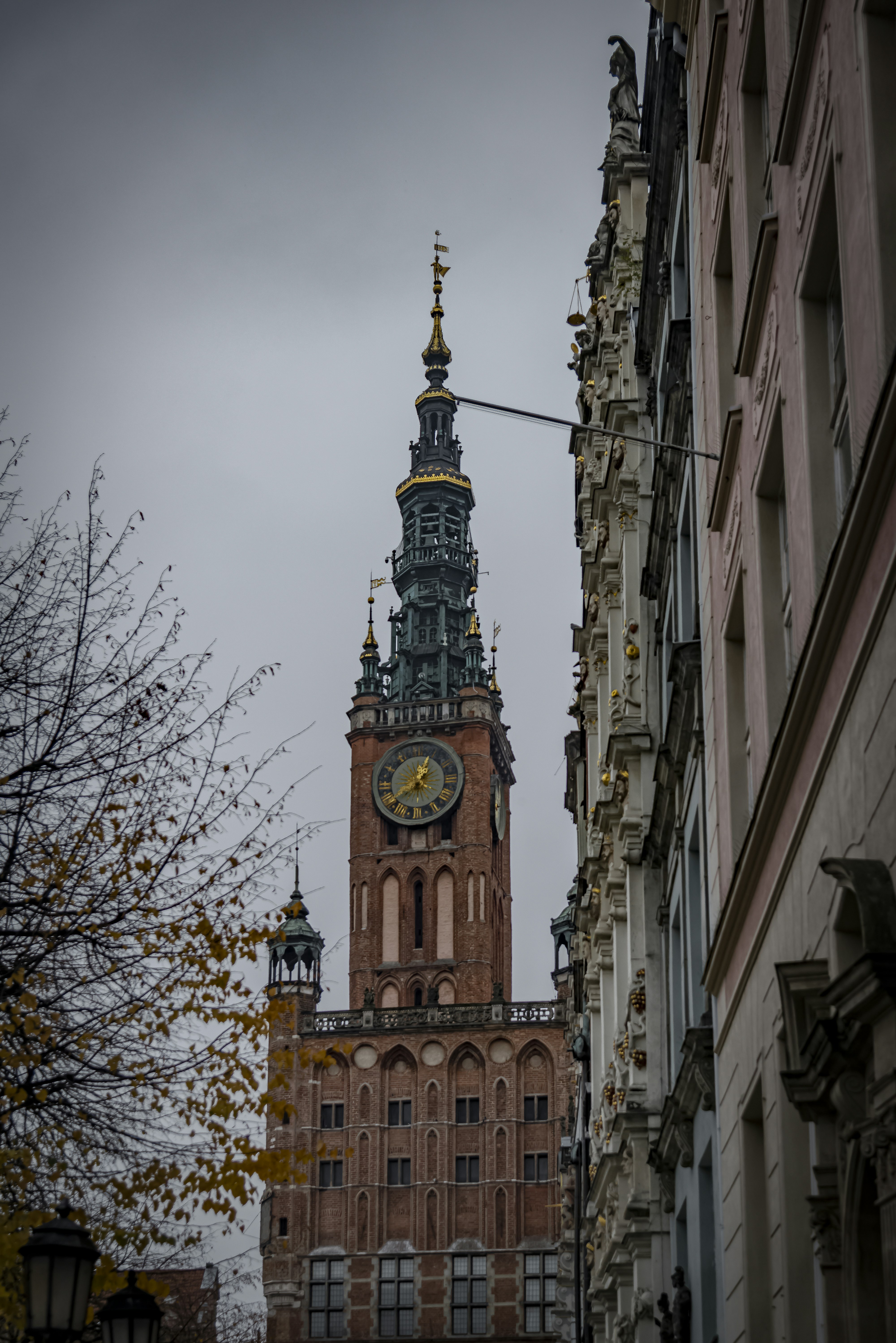 Gothic Clocktower Rising Over a Narrow, Ornamented Street