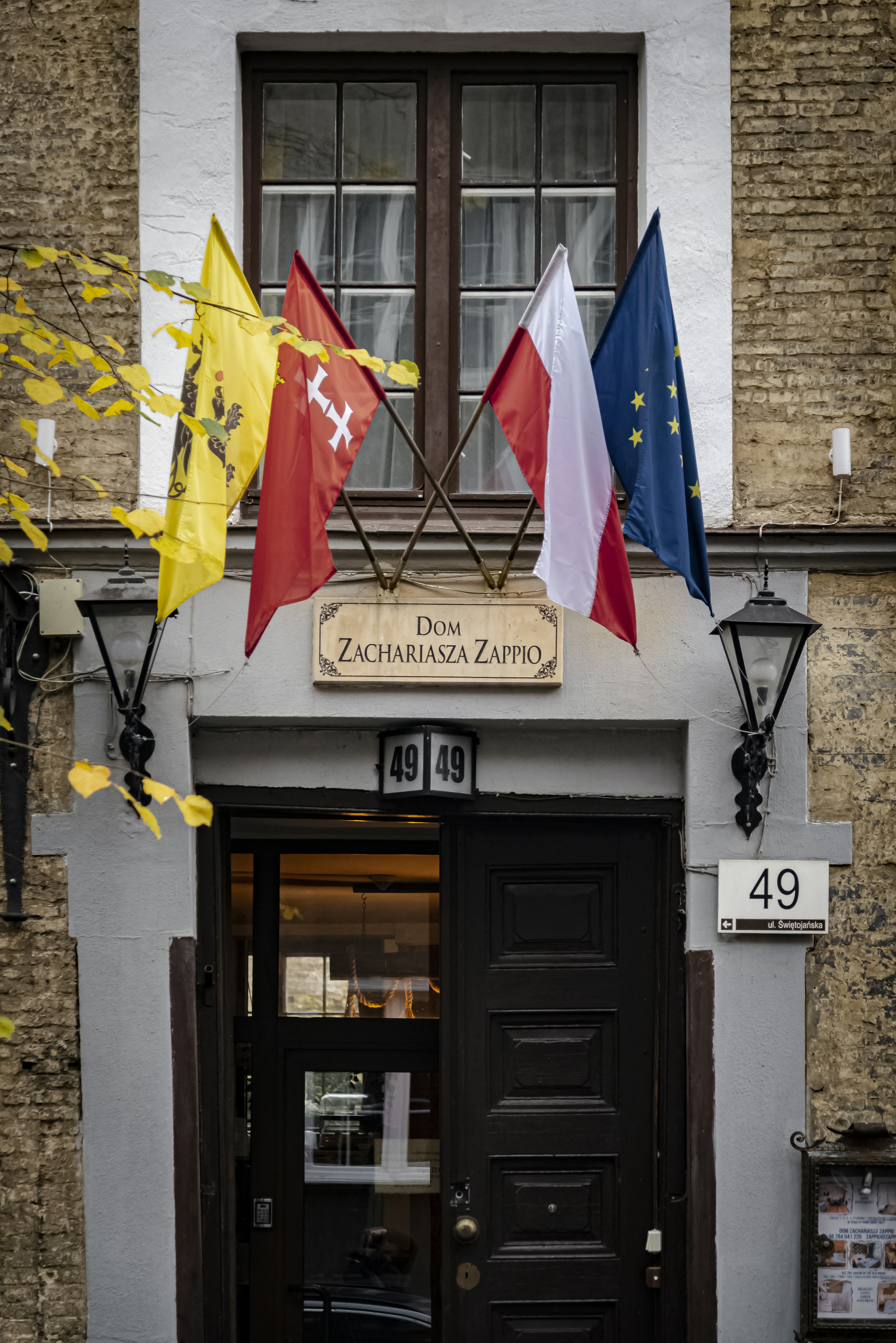 Flags Above the Dom Zachariasza Zappio Doorway
