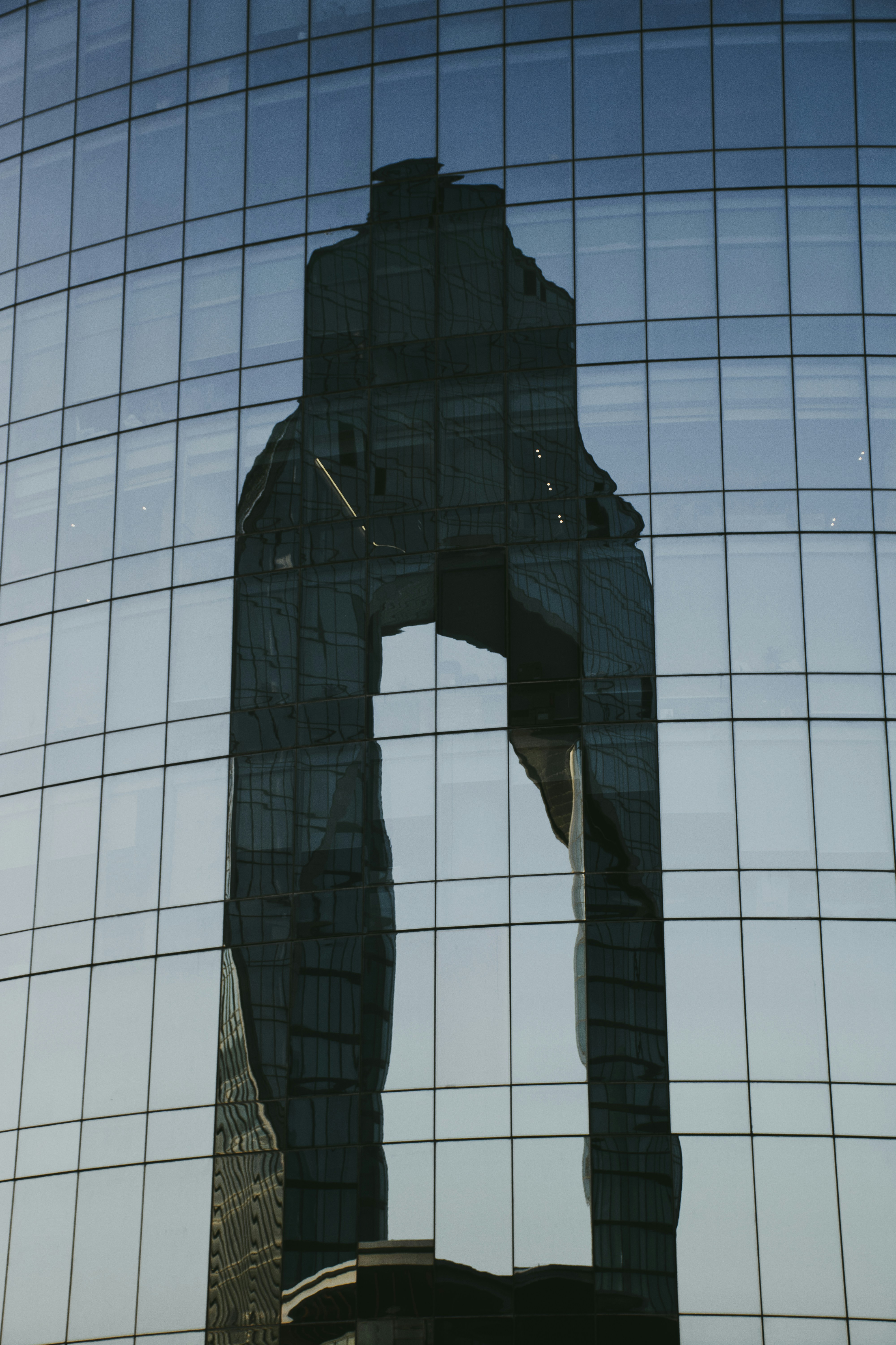 Reflections of Modernity: A Dance of Glass and Shadows