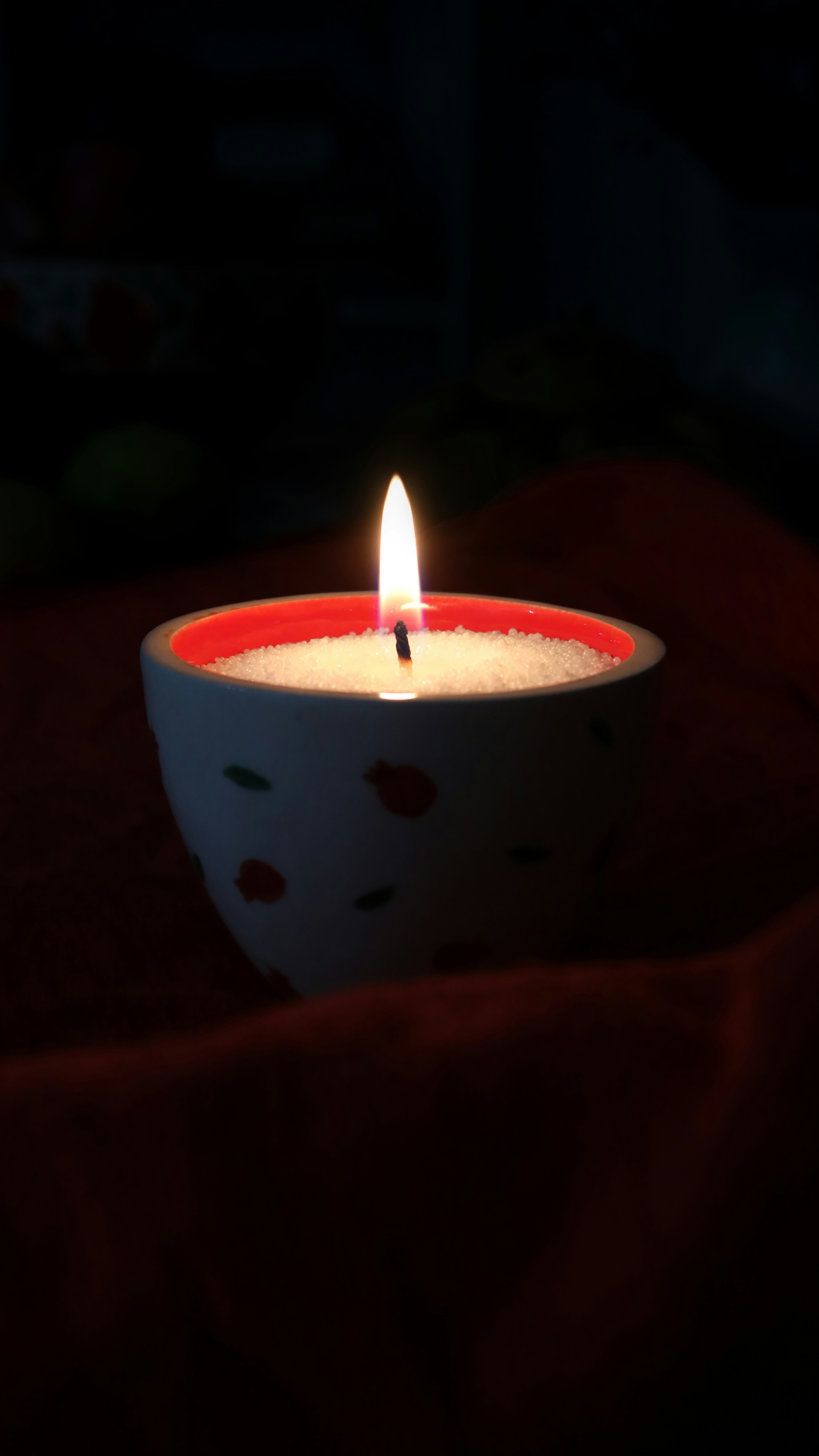 A lit candle in a decorative bowl with red accents. photo – Free ...