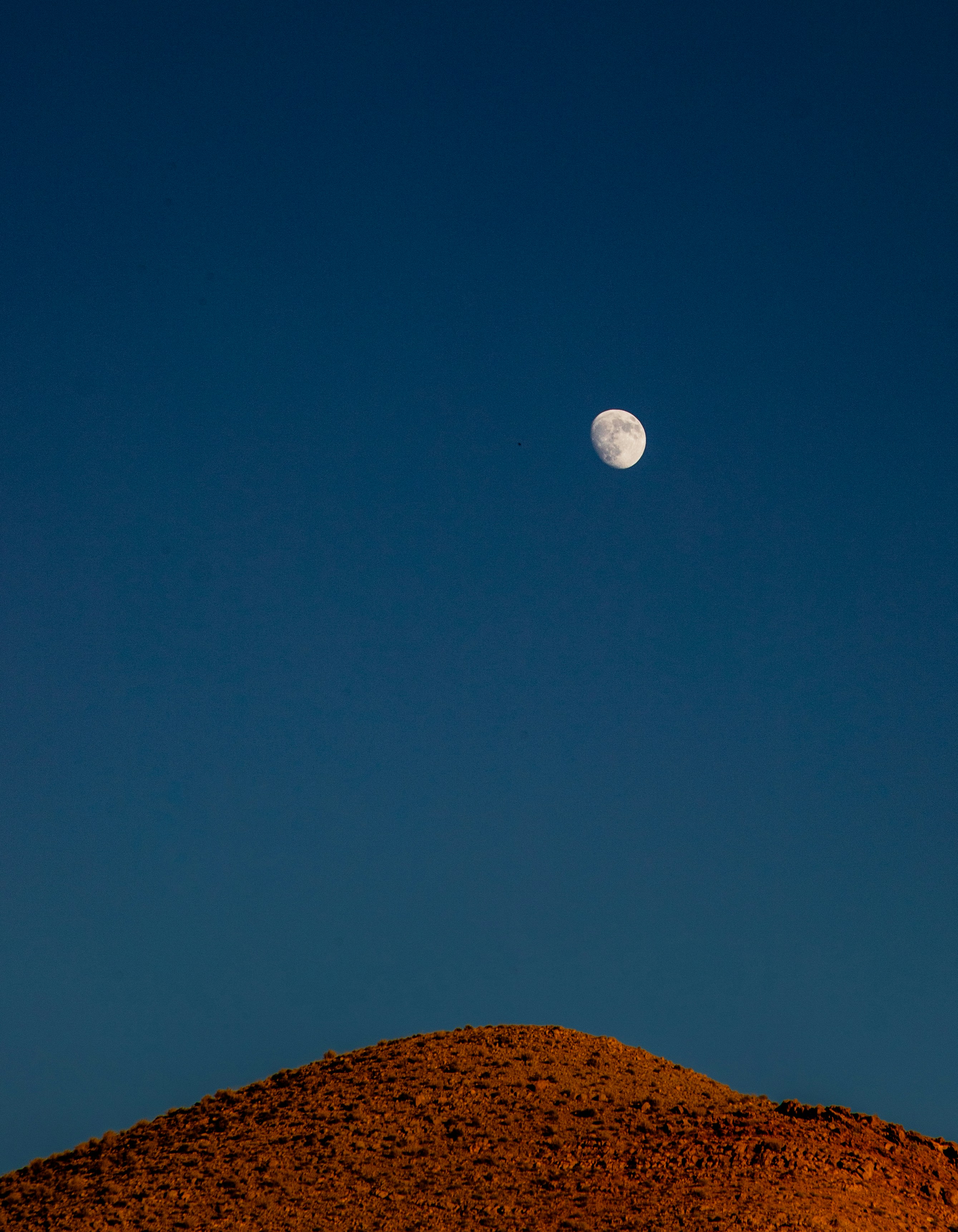 Lunar Serenity Over Arid Landscapes