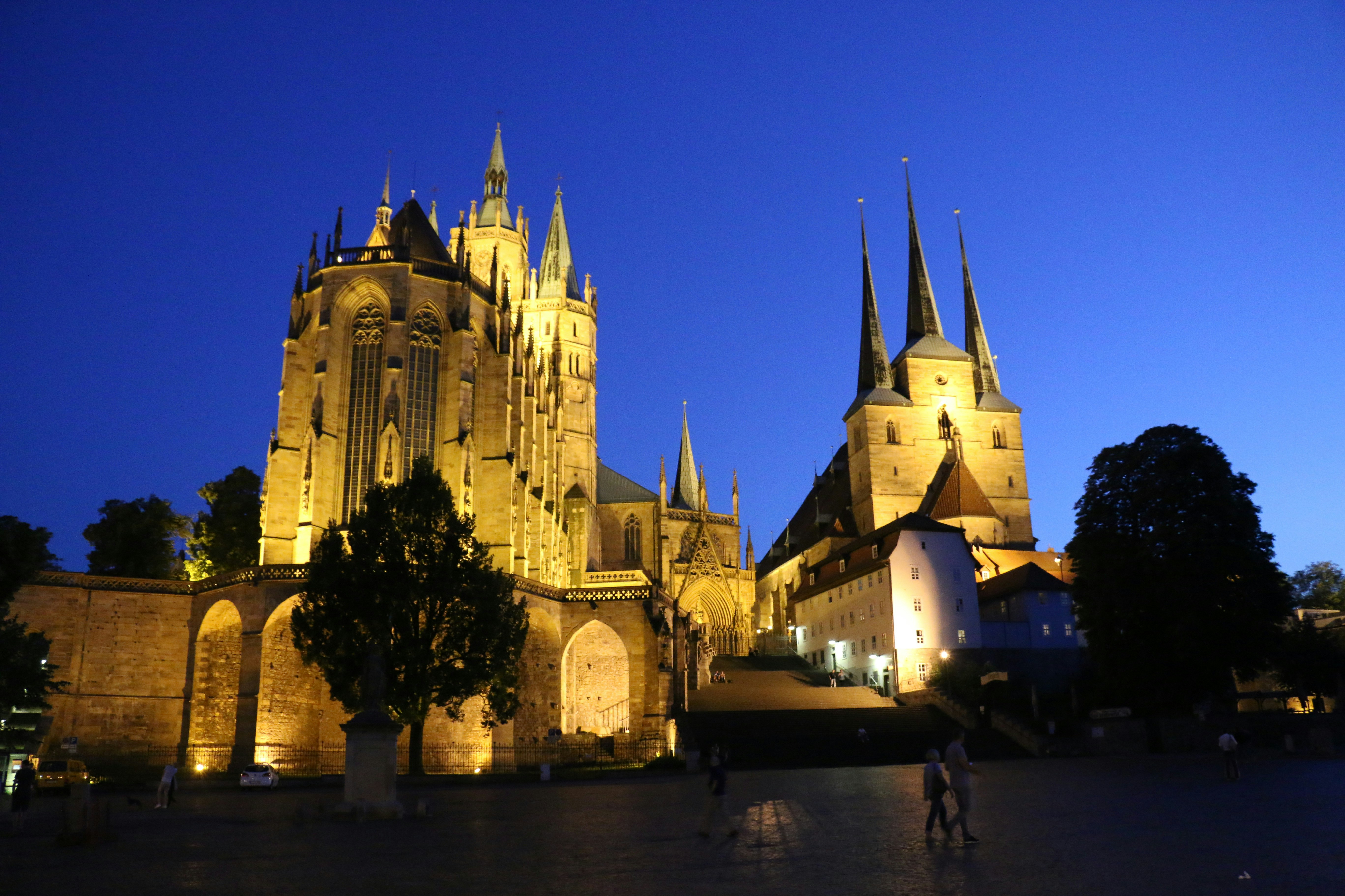 Amber-lit Gothic: Night Towers Rise Over a City Cathedral