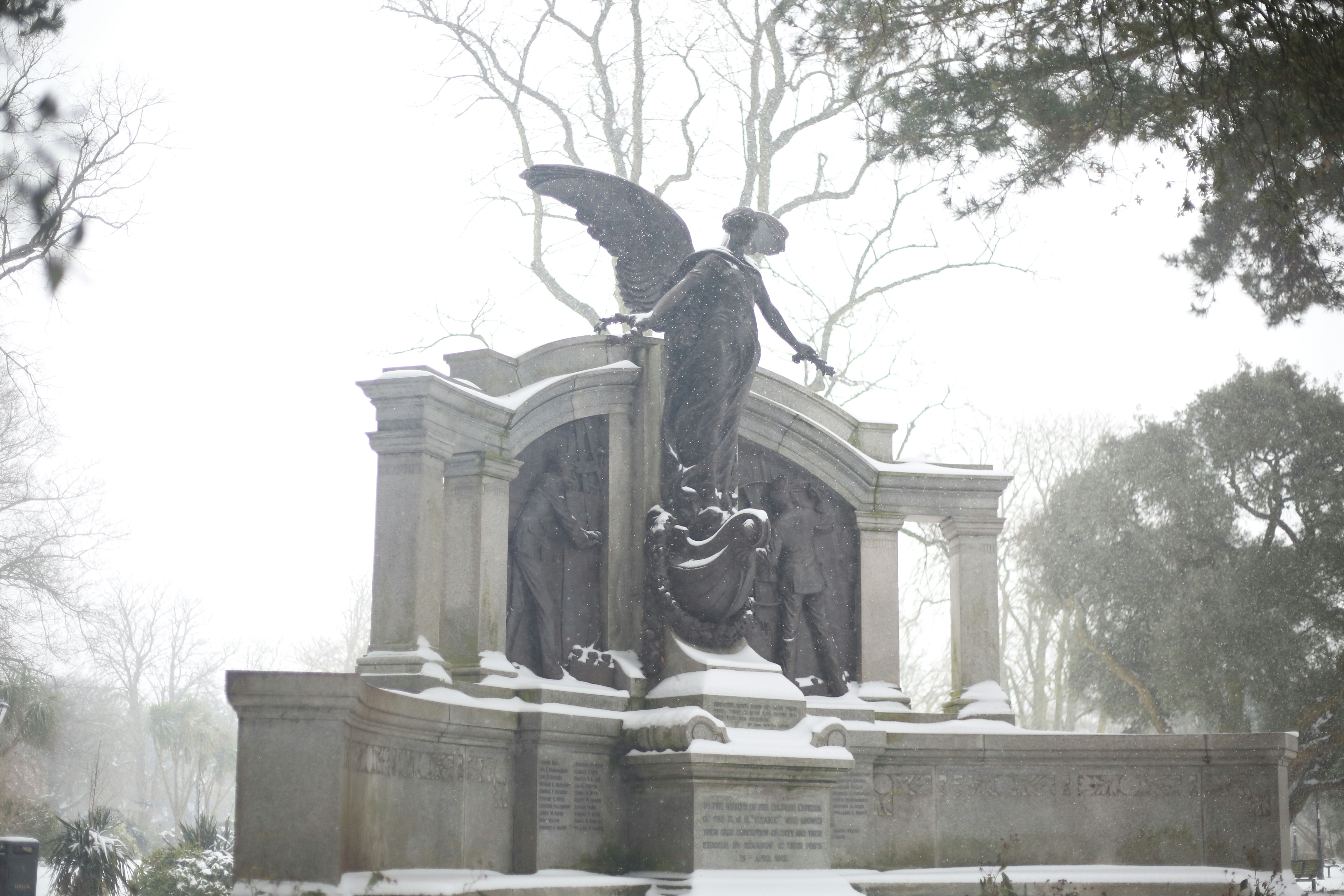 Winged Sentinel in a Snowbound Memorial