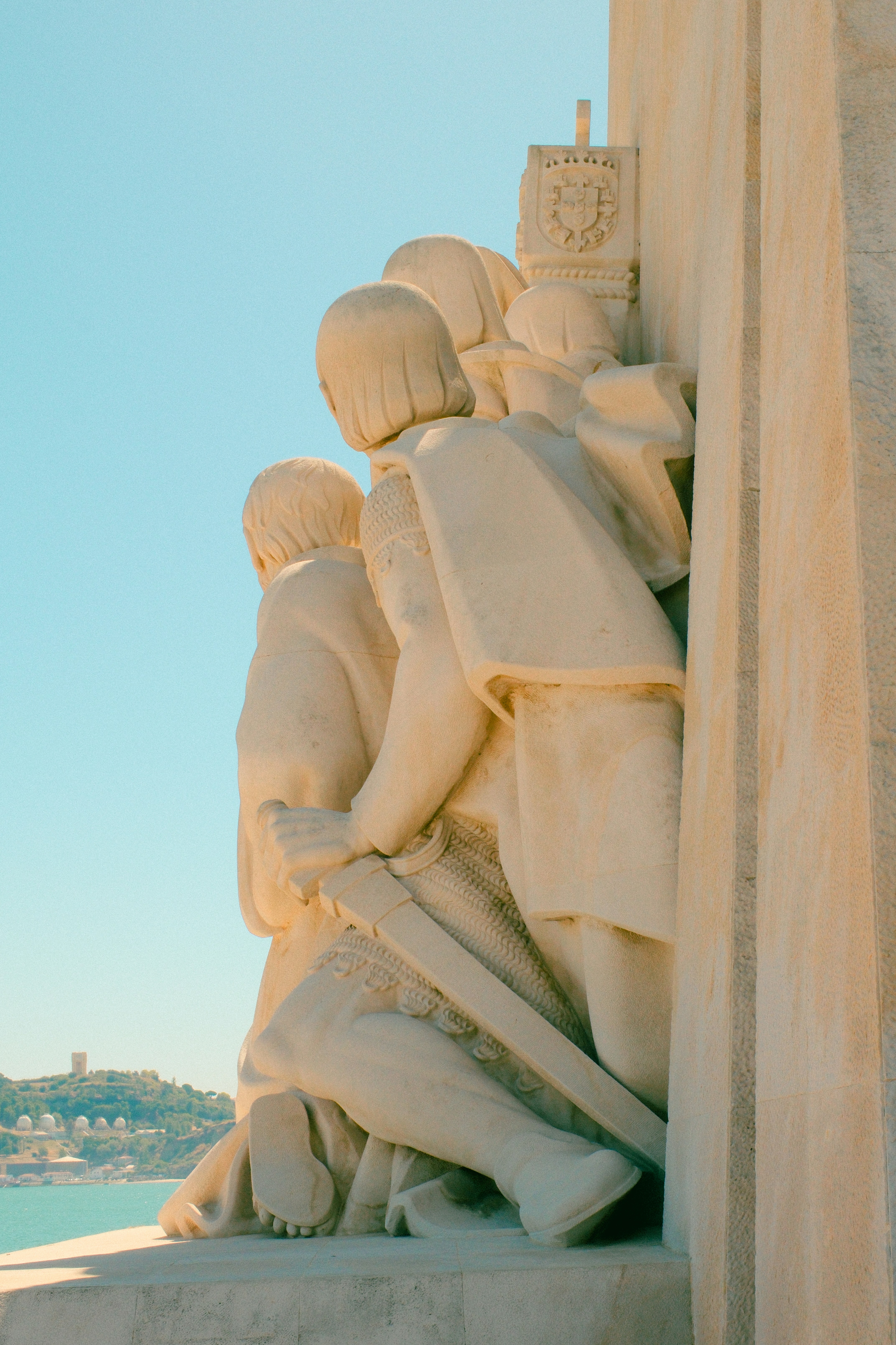 Maritime Marble: Kneeling Guardians by the Sea