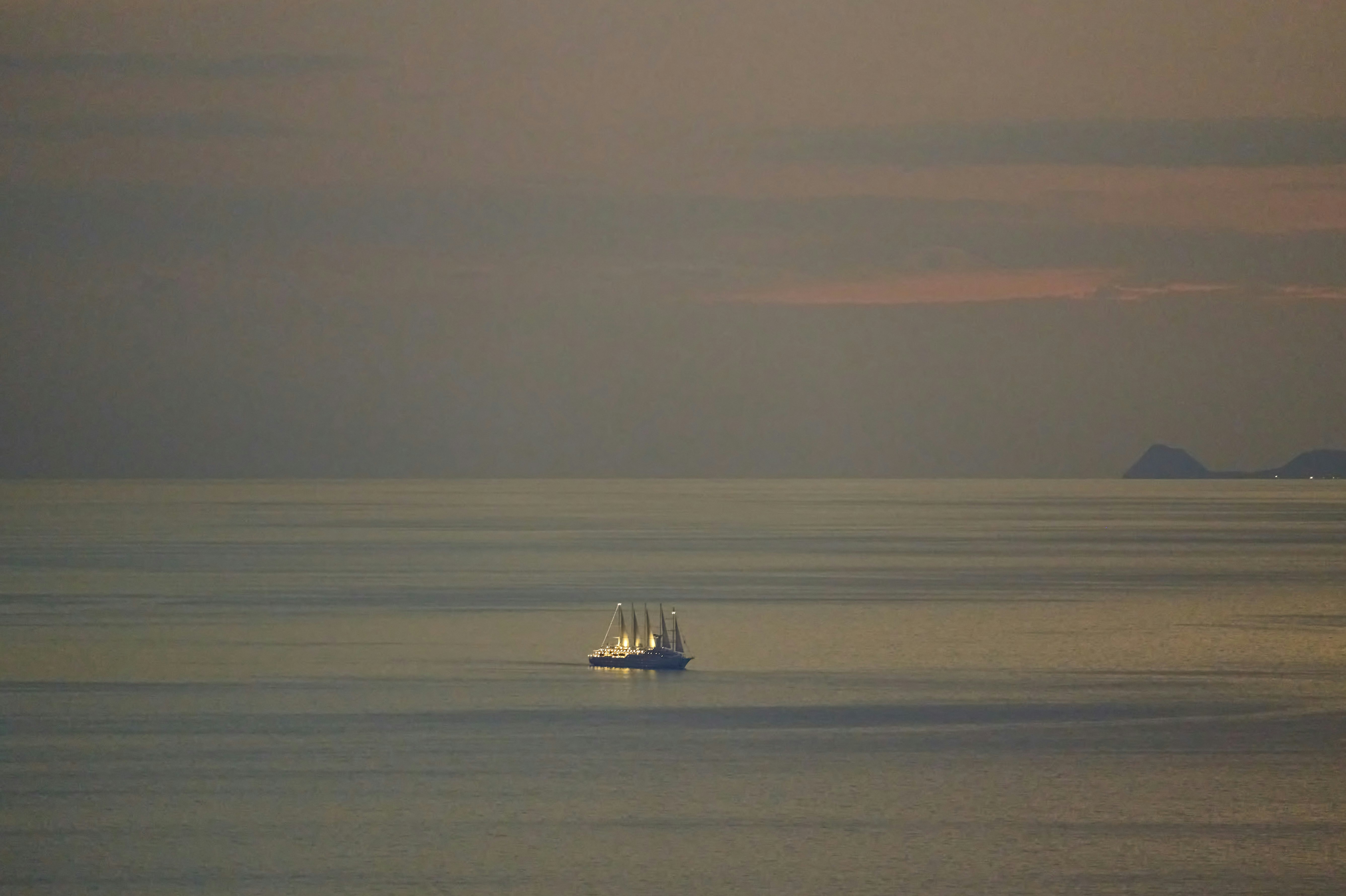 Serenity on the Horizon: A Sailboat's Journey