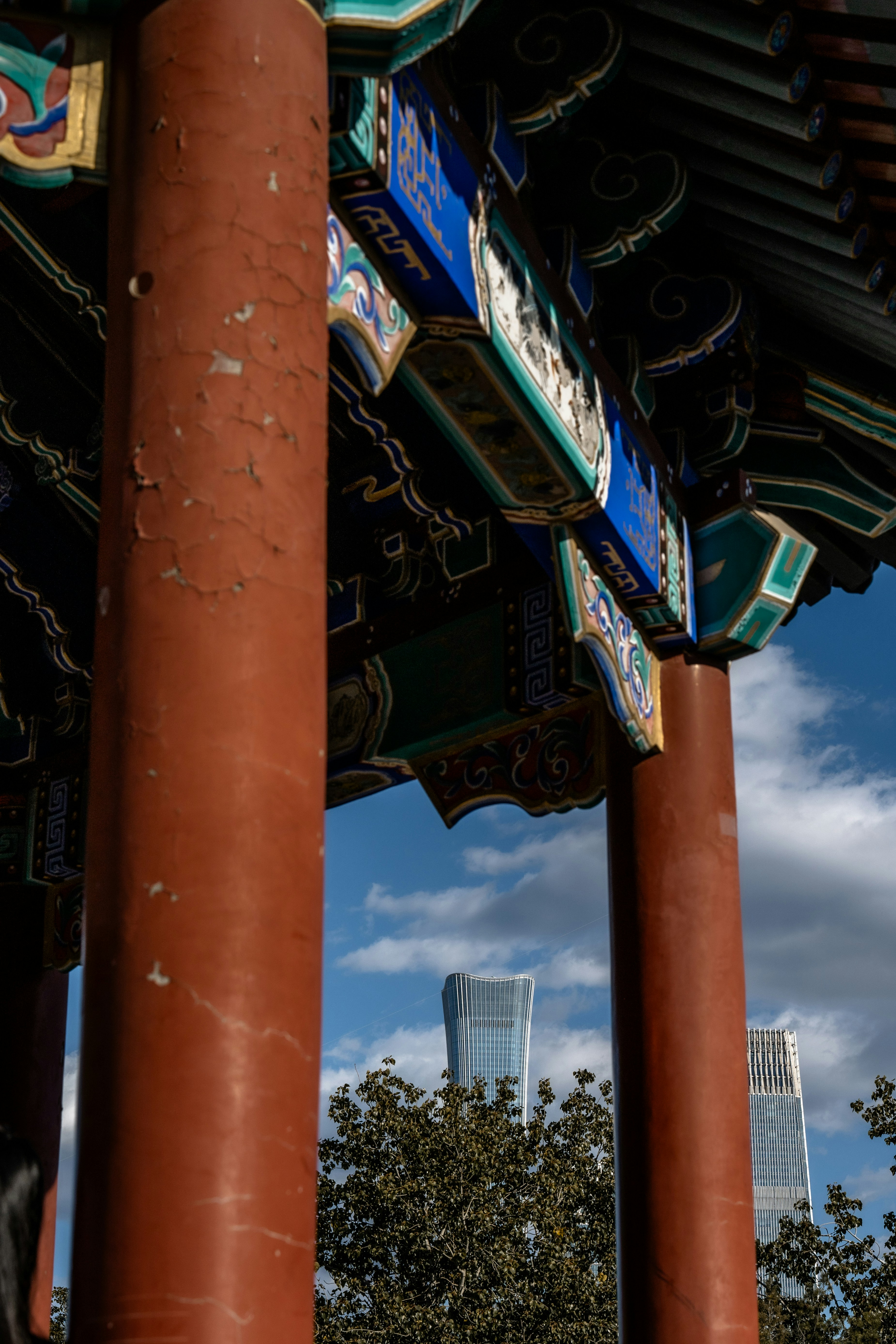 Between Red Pillars, a Modern Skyline Emerges