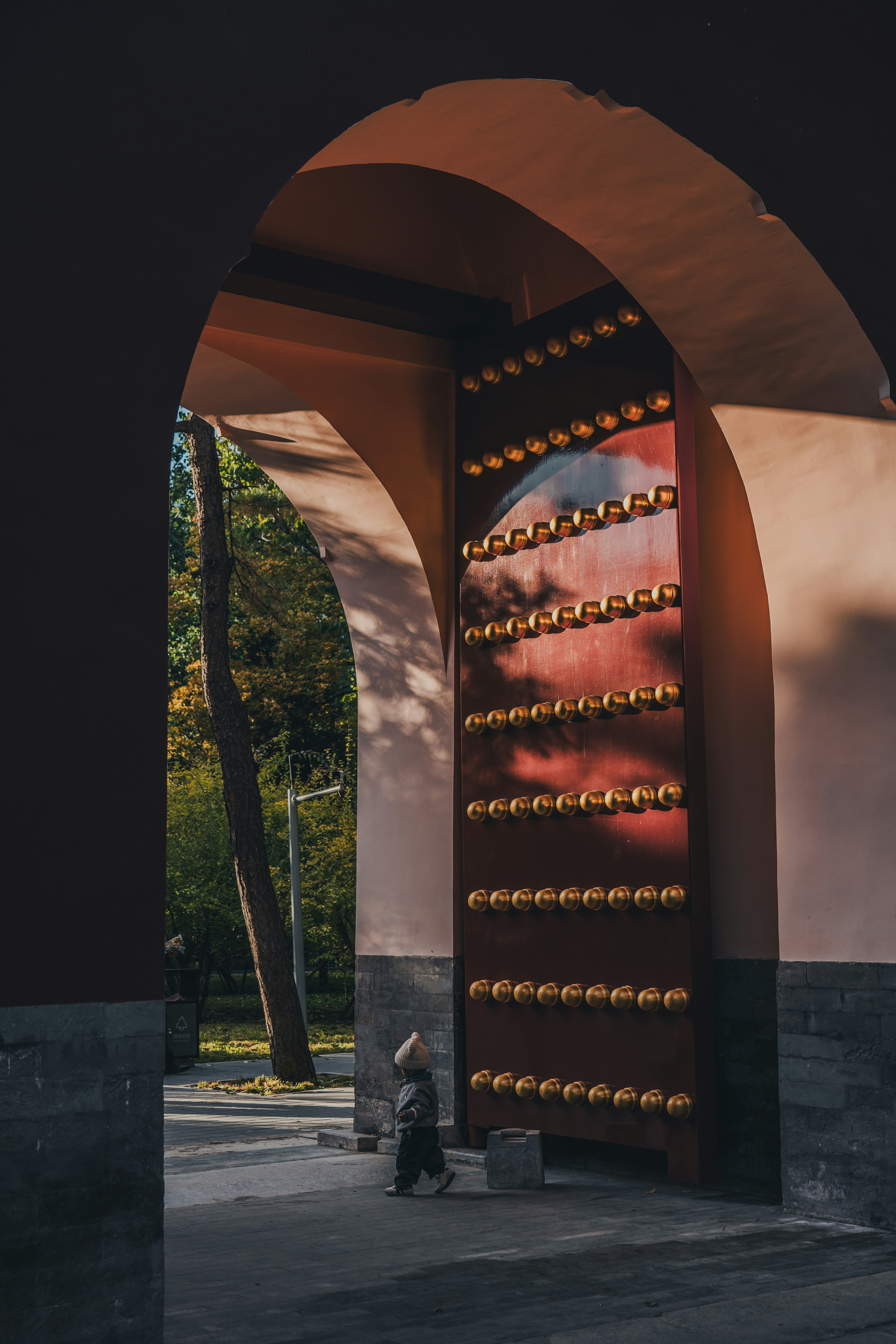 Gate of Gold Bolts: Archway Quietly Framed by Light