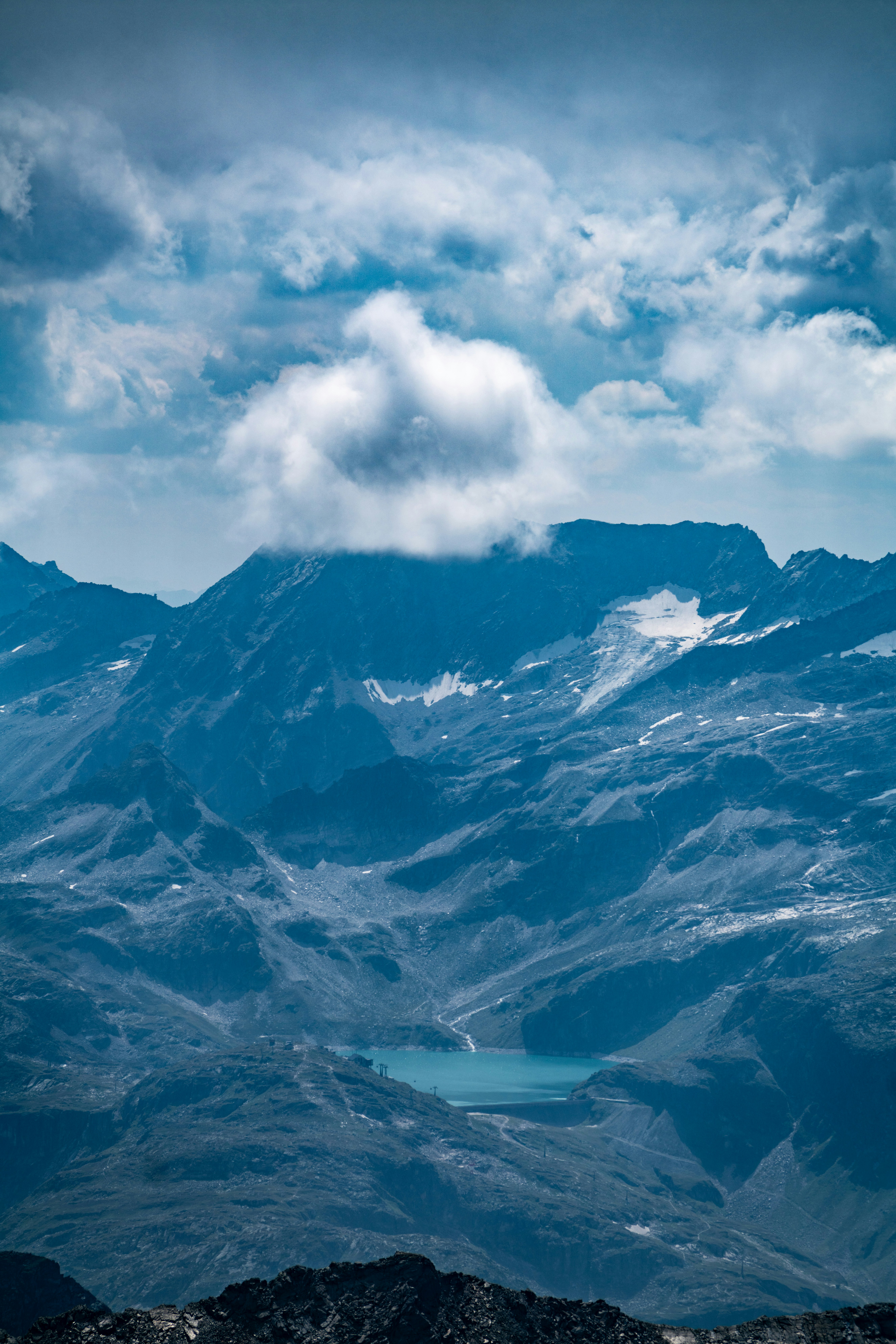 A vast mountain range with a small lake. photo – Free Mountain range ...