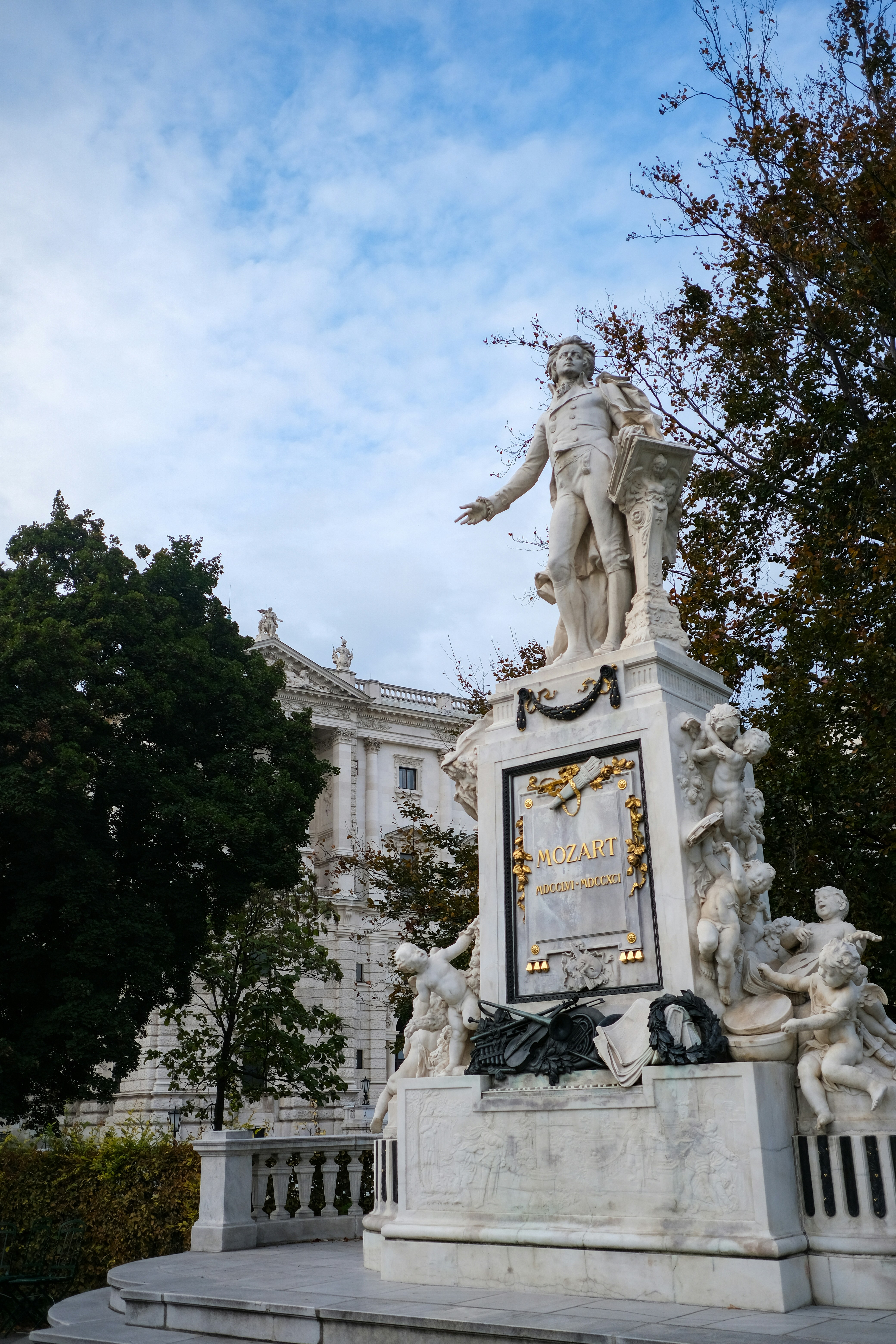 Mozart monument in a park with building behind photo – Free Statue ...