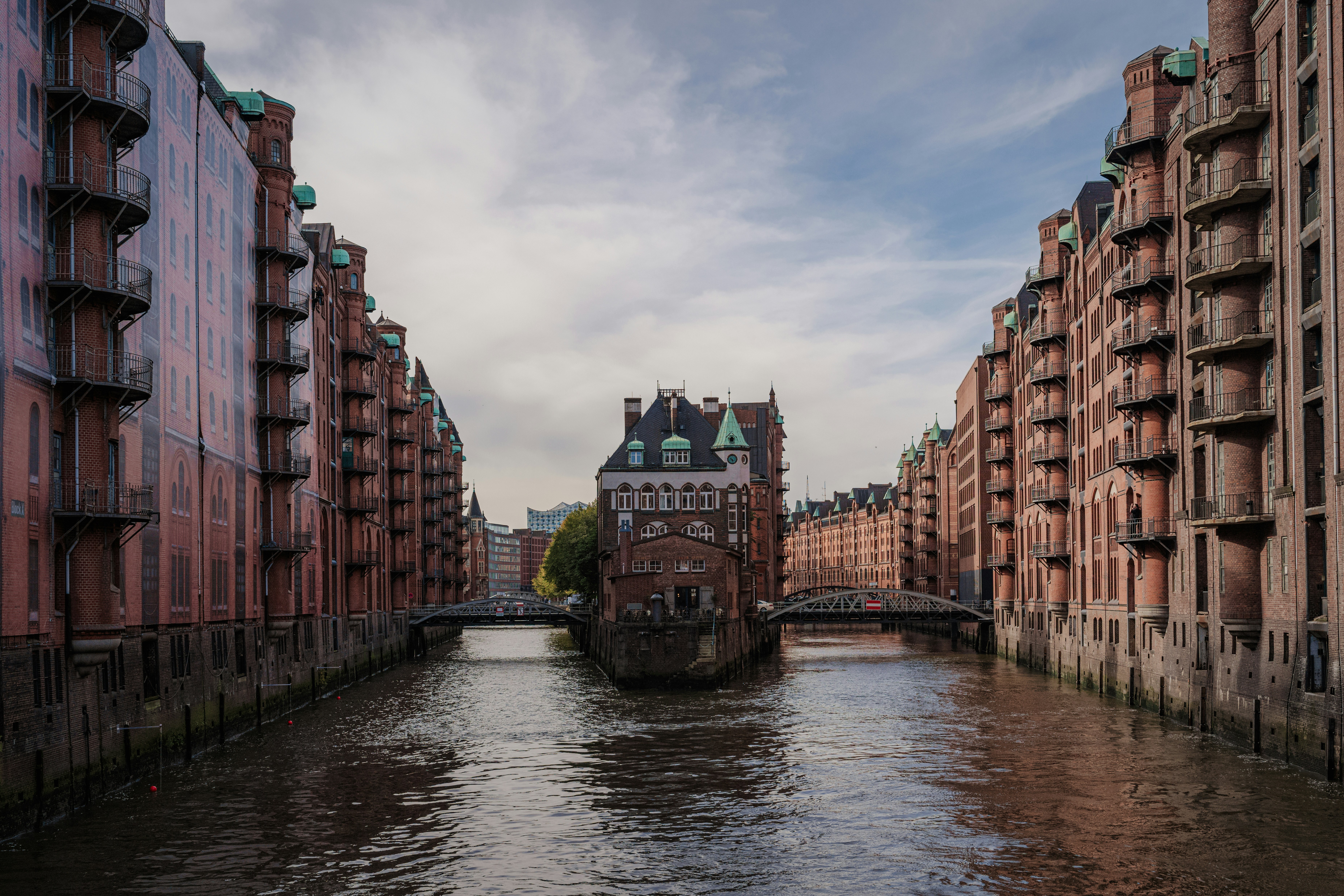 Water canal between historic brick buildings in hamburg