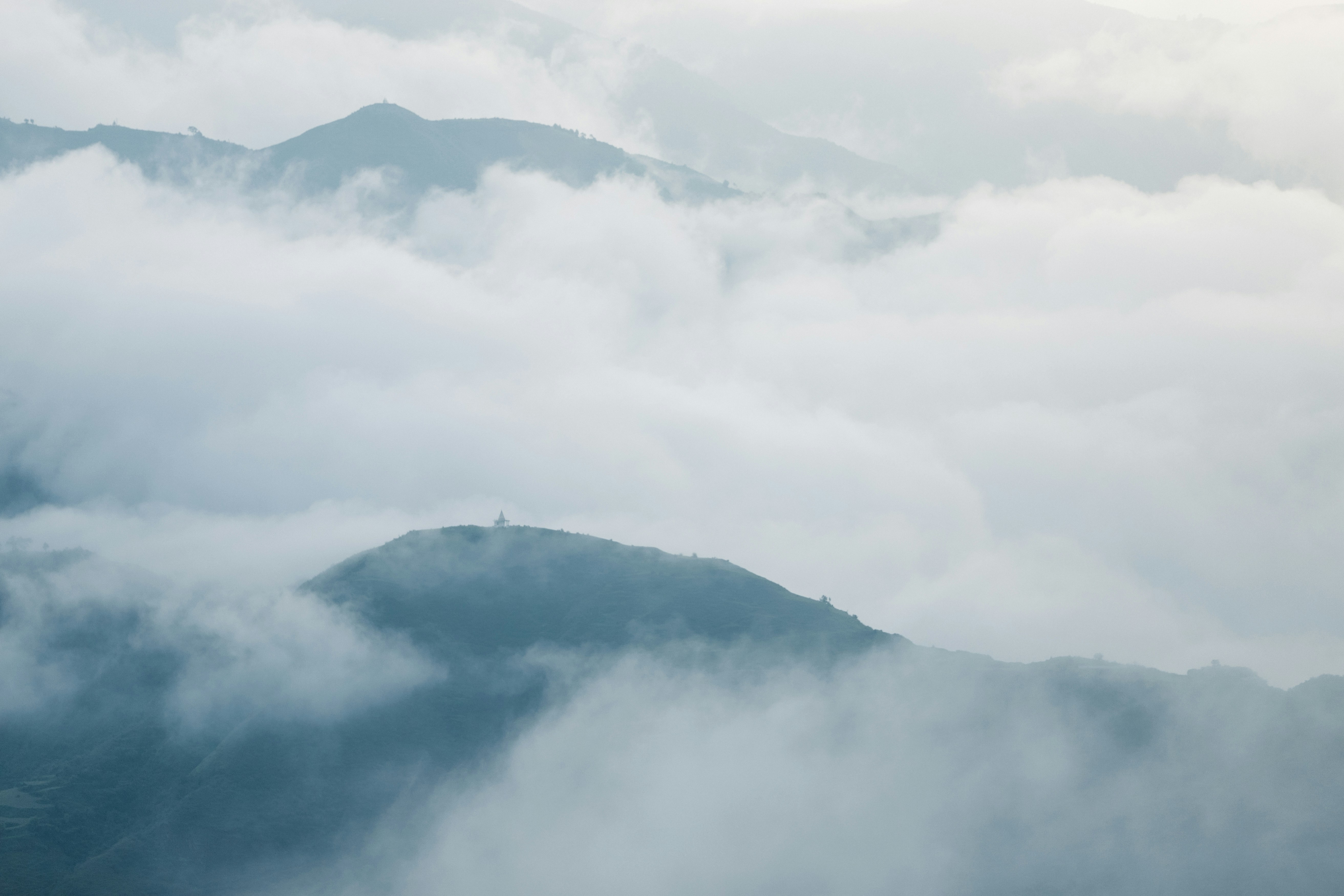 Veils of Mist Over Mountain Ridges