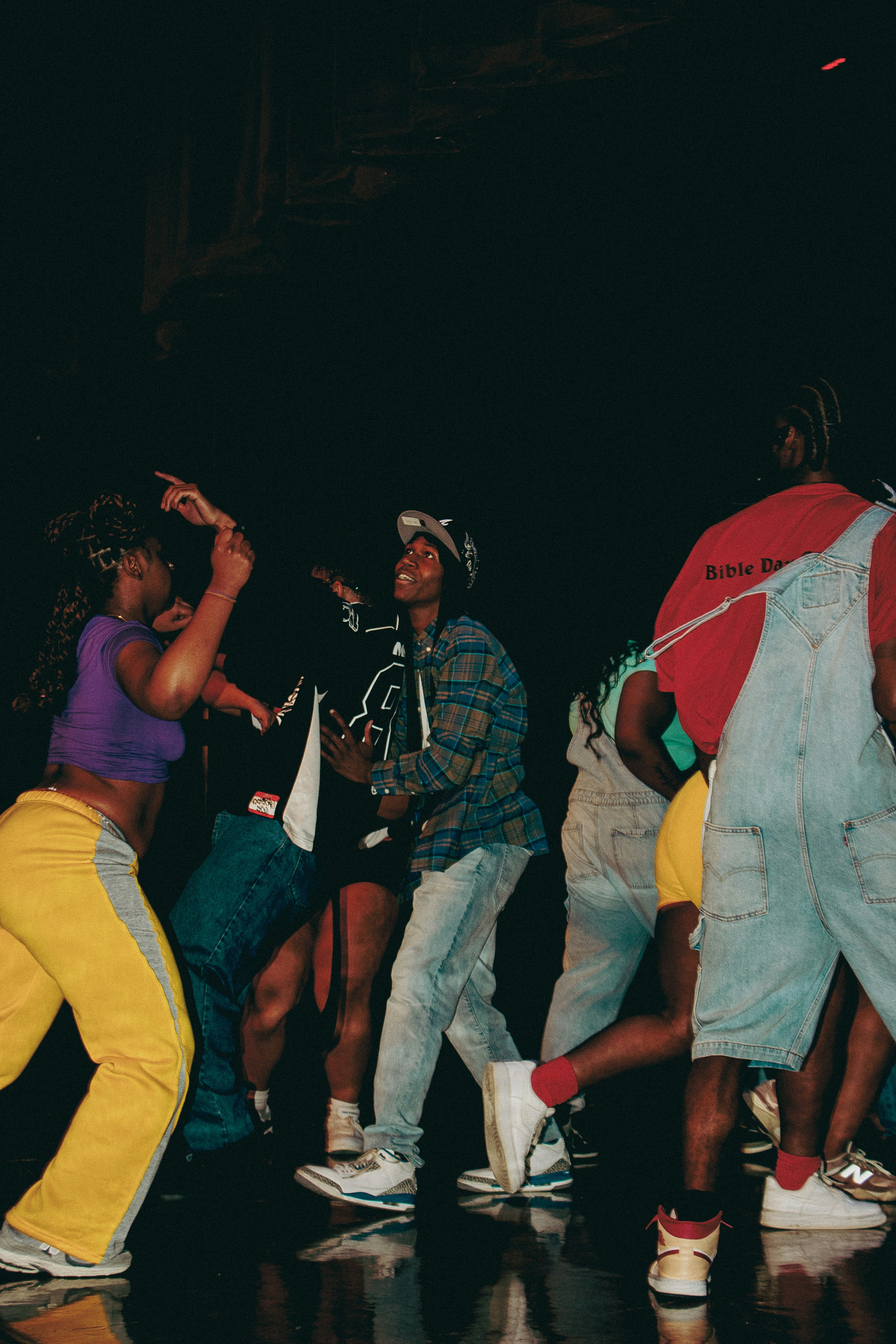 Midnight Jam: Plaid-Clad Dancer Anchors a Crowded Stage
