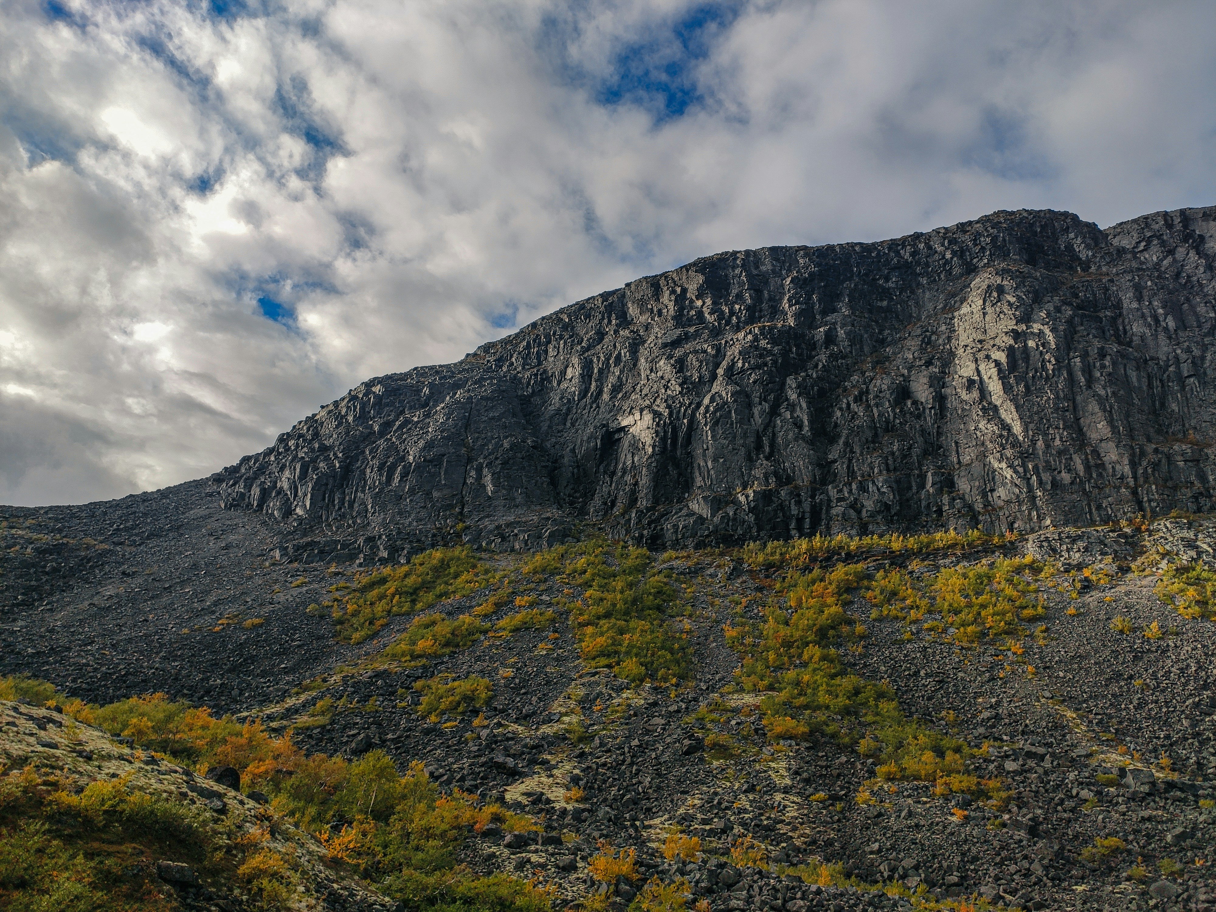 Autumn Scree and the Granite Ridge under a Patchwork Sky