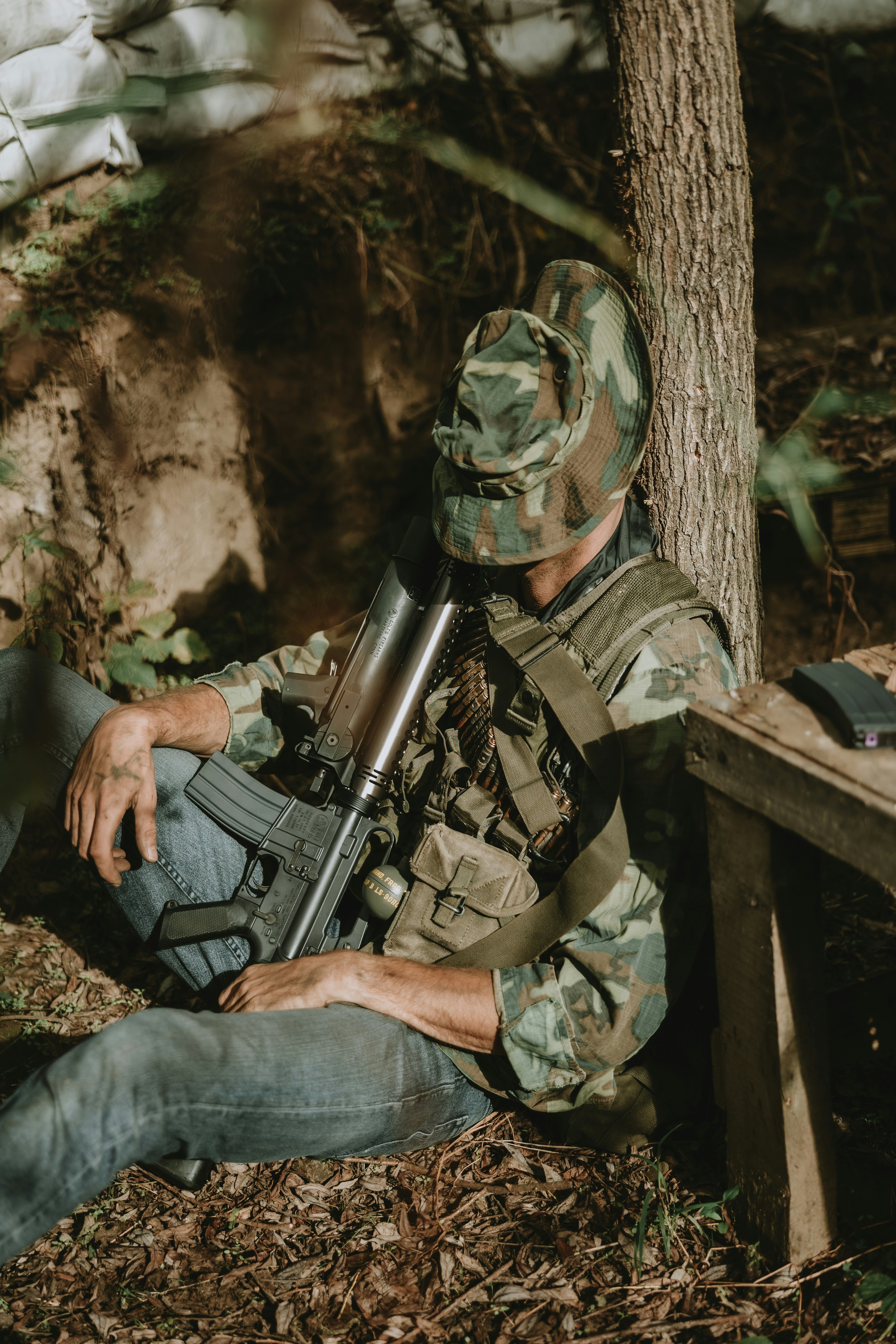 Camouflaged Quietude: Rifle at the Forest's Edge