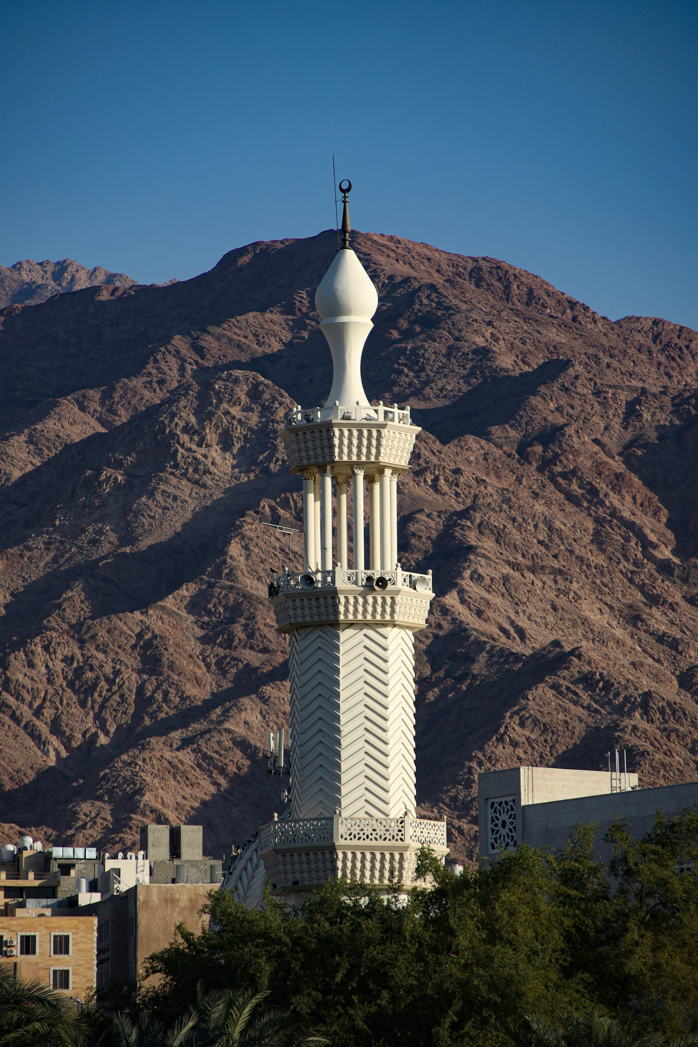 Ivory Spire Rising Above Desert Ridges