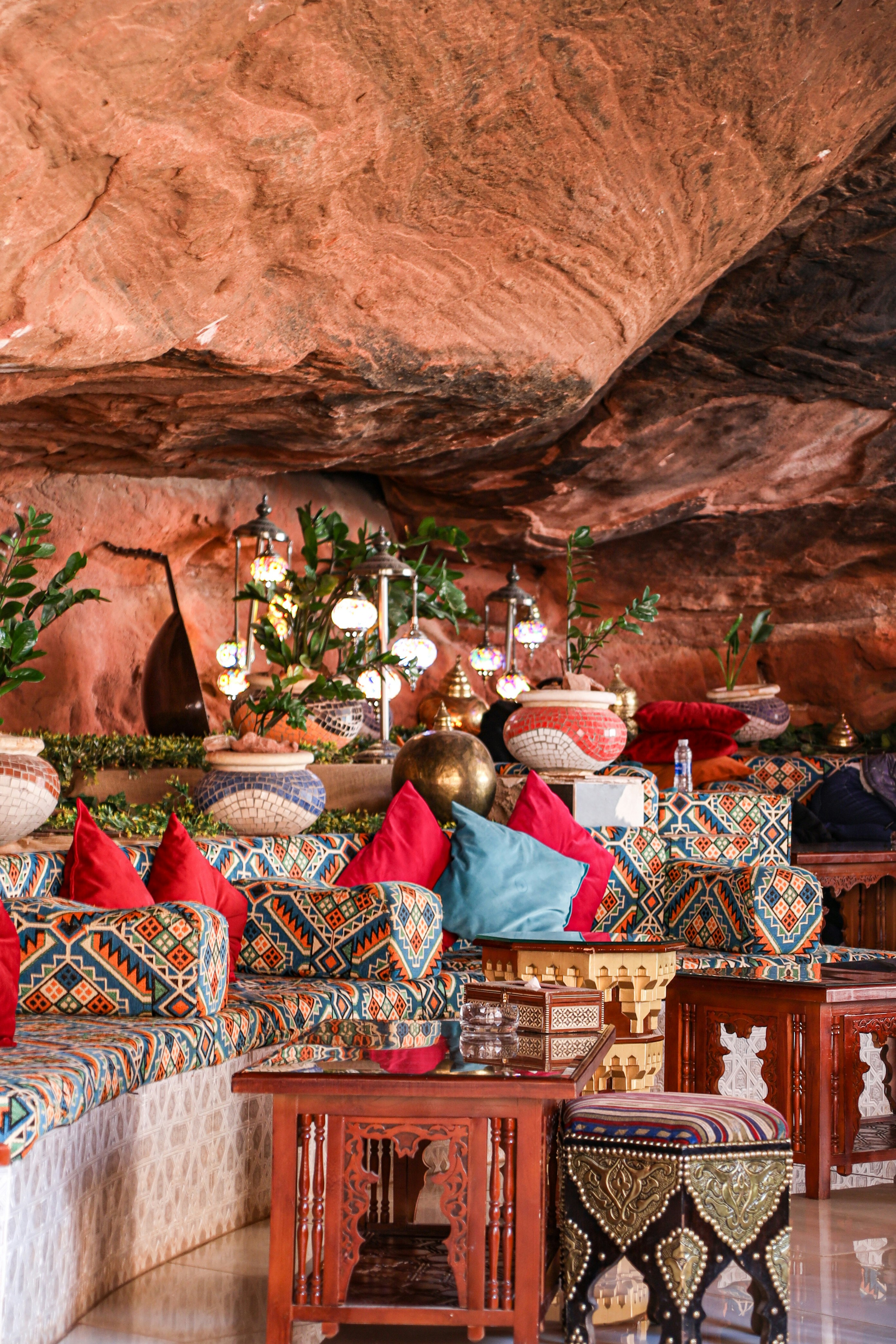Canyon Lounge Tapestry: Vibrant Seating Under a Rust-Red Rock Canopy