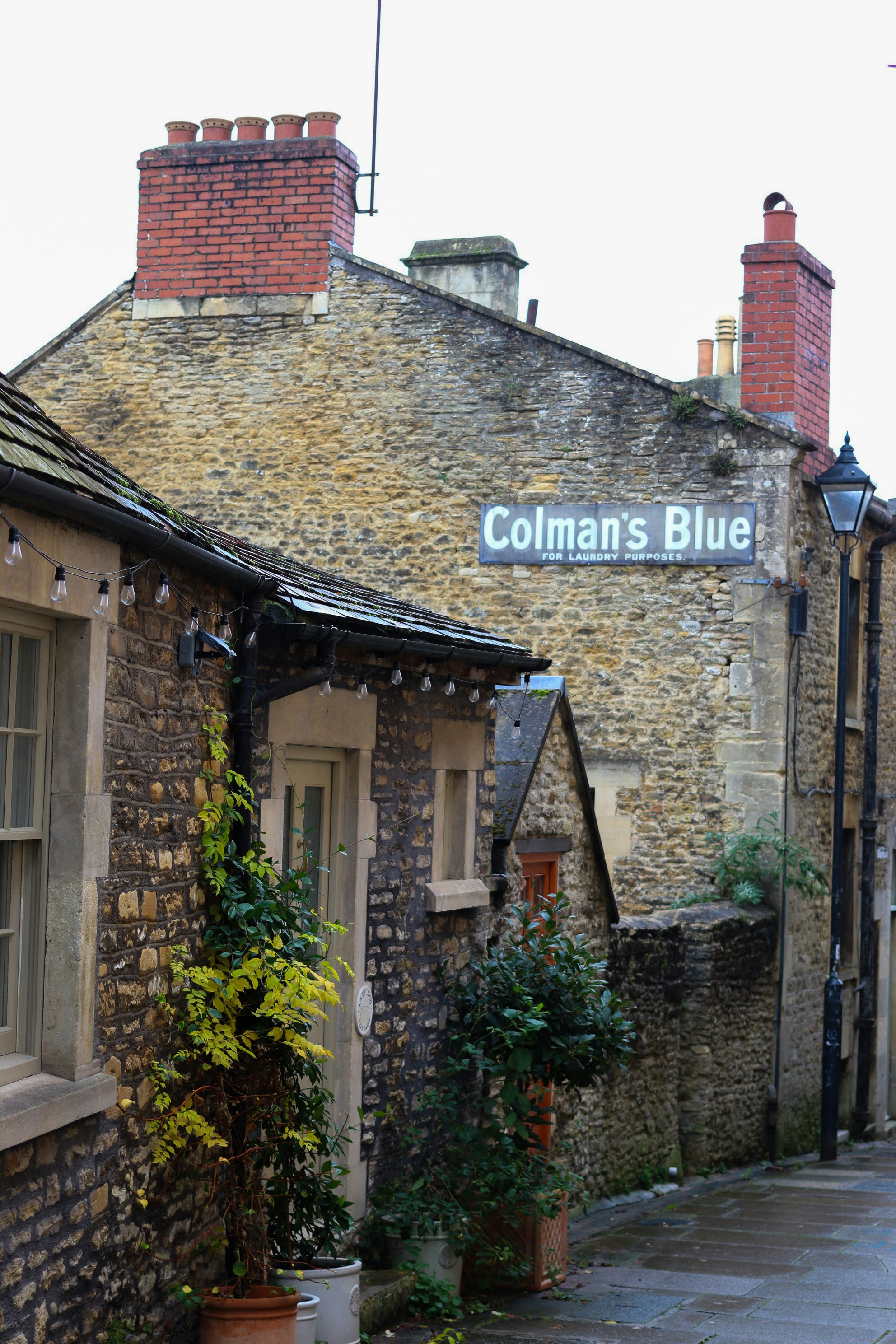 Stone buildings with "colman's blue" sign photo – Free Window Image on ...