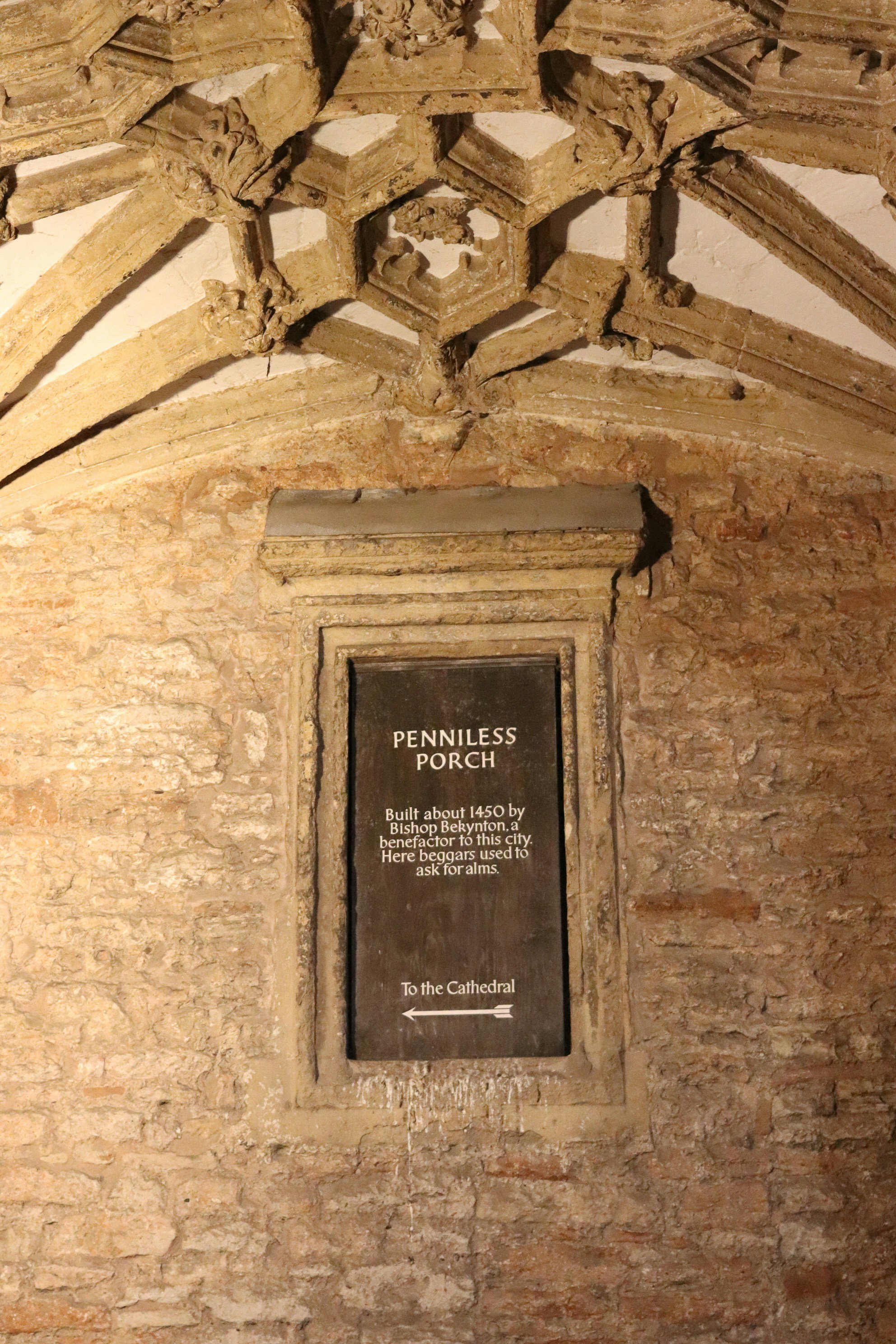 Brick Arch and the Penniless Porch Plaque: Echoes of a Medieval Corridor