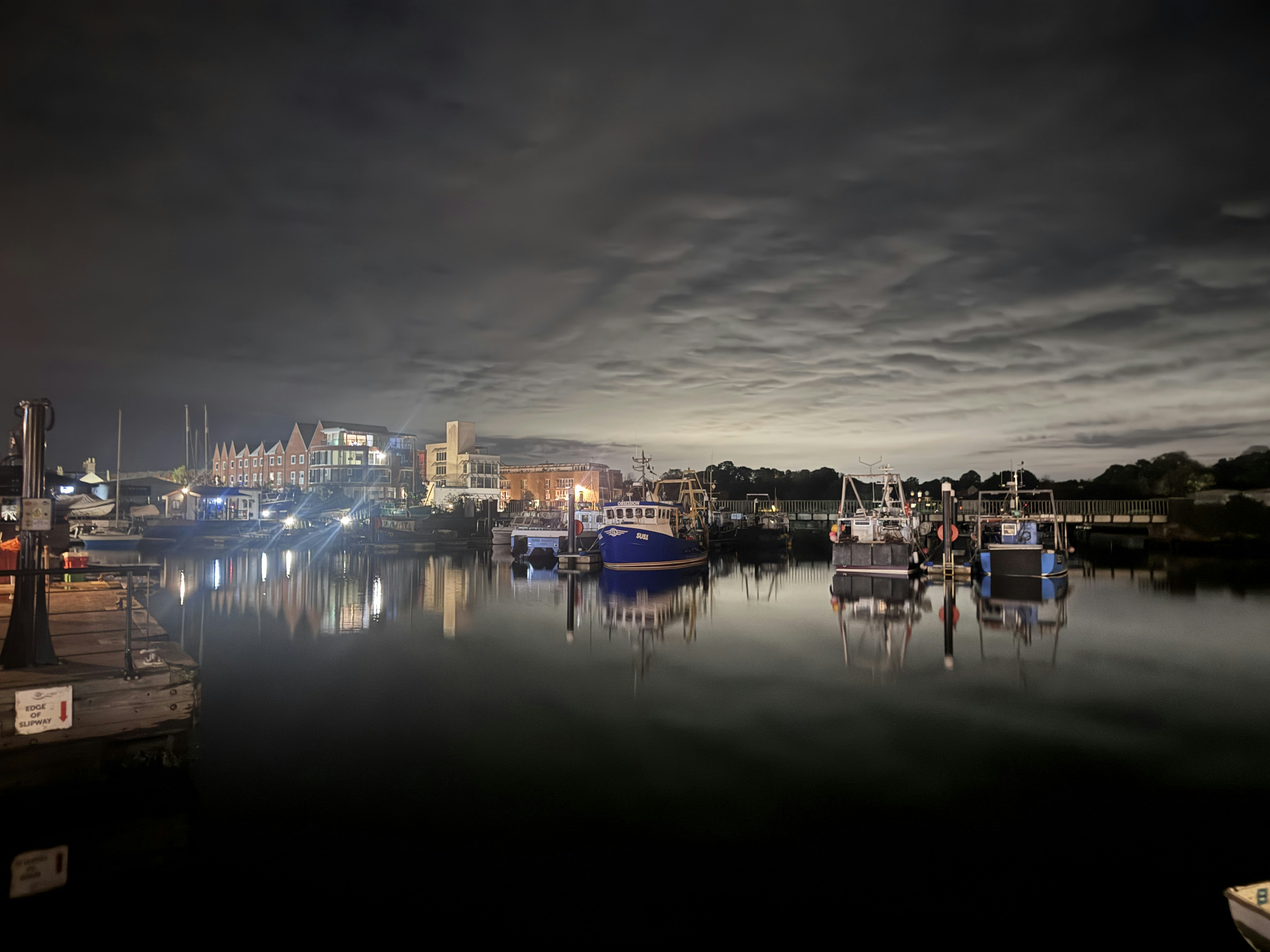 Boats docked in a harbor at night with city lights. photo – Free Night ...