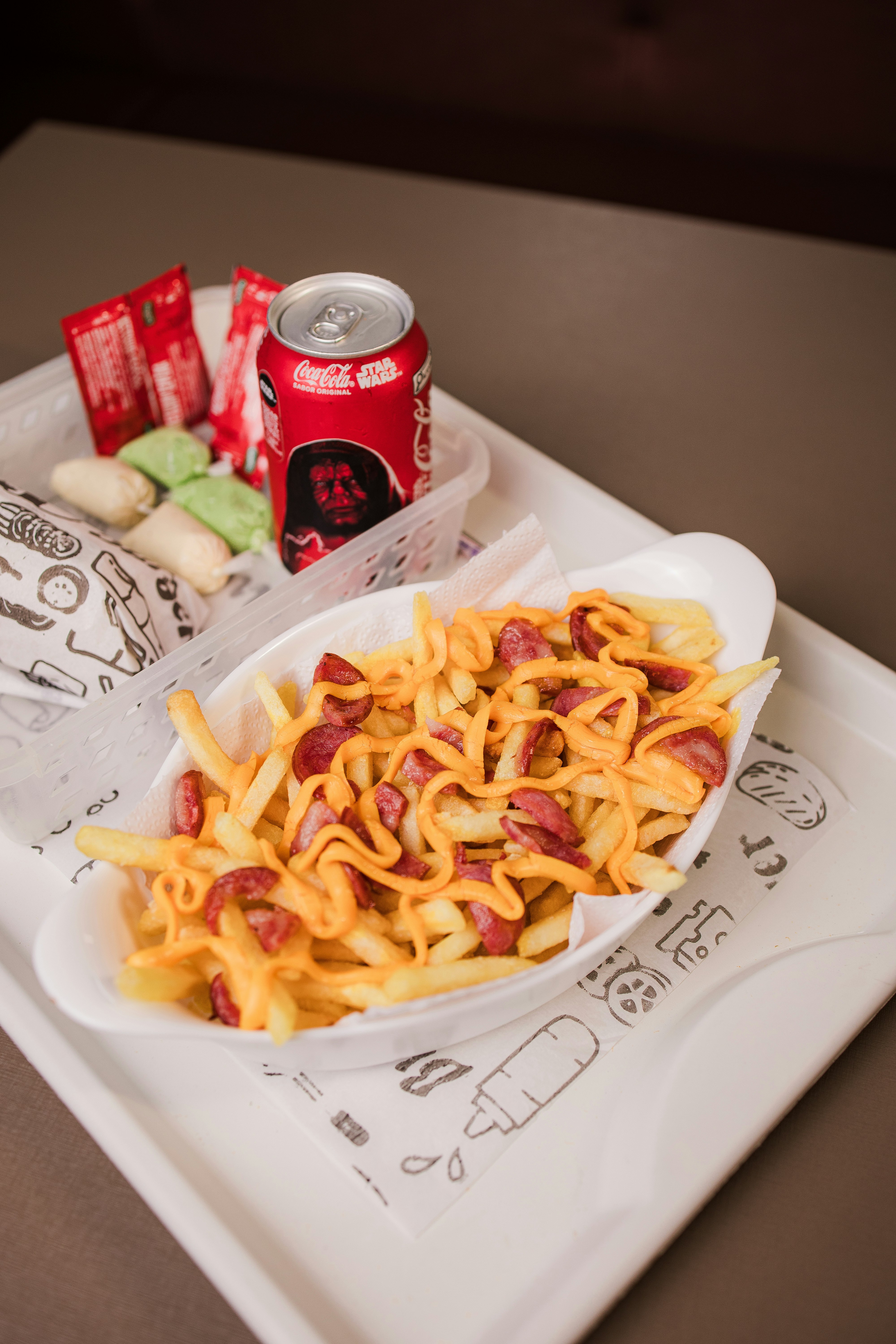 Crispy Bacon-Cheese Fries on a Minimal Tray with a Coca-Cola Backdrop