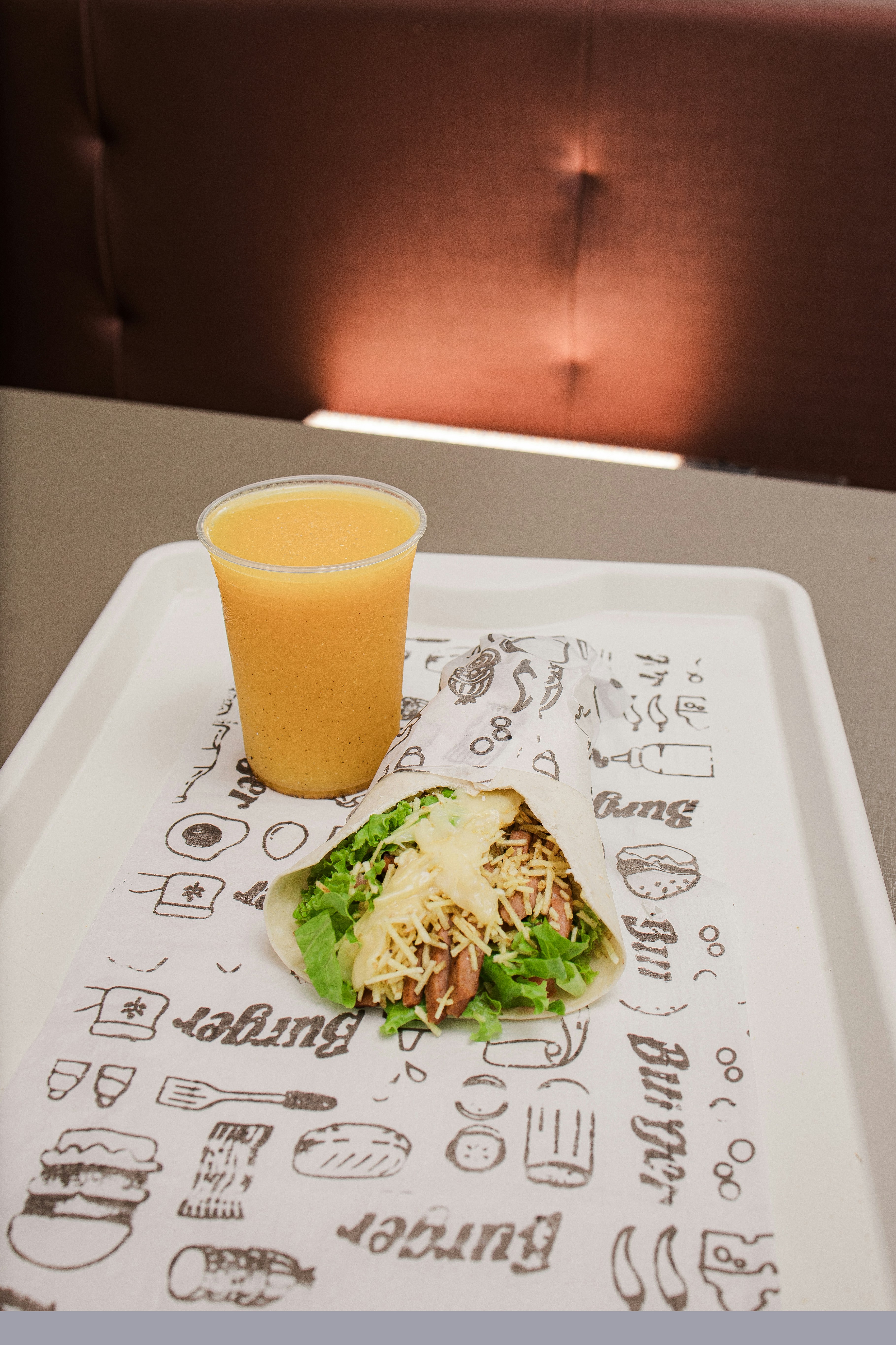 A Flavorful Encounter: Fresh Wrap and Juice Delight