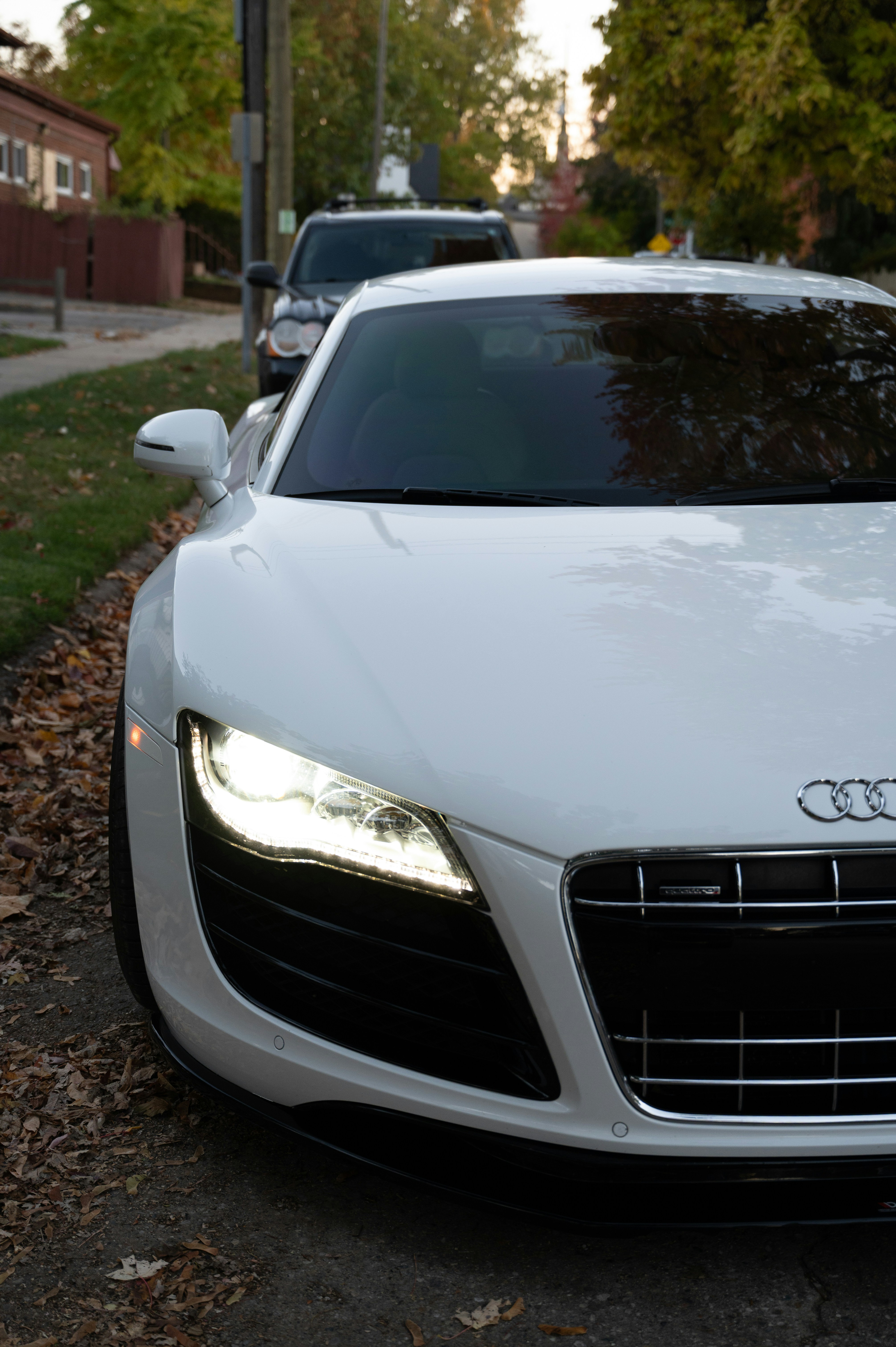 Edge-lit Front: White Audi R8 Anchors a Quiet Suburban Street