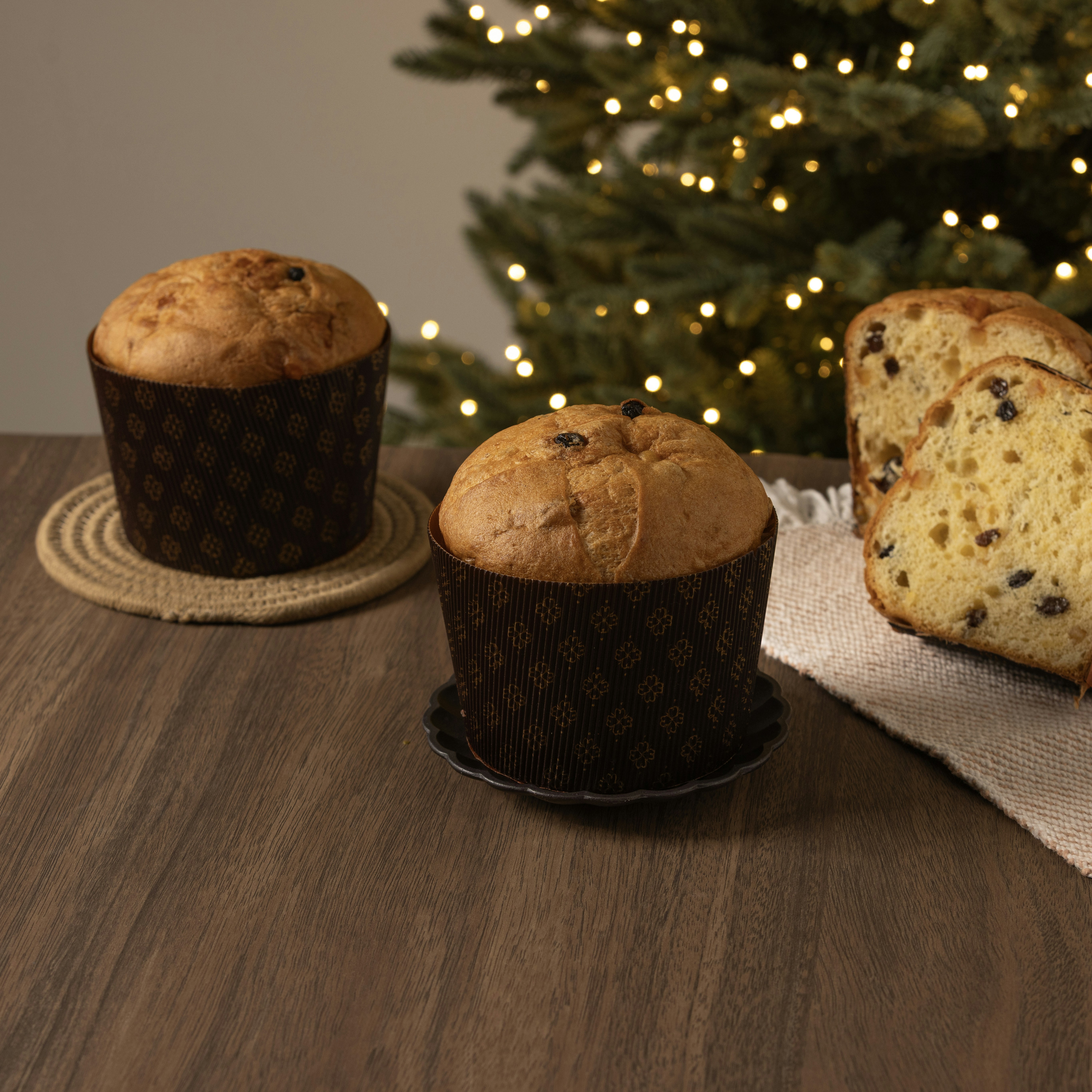 Two panettone cakes with a slice on a table photo – Free Christmas ...