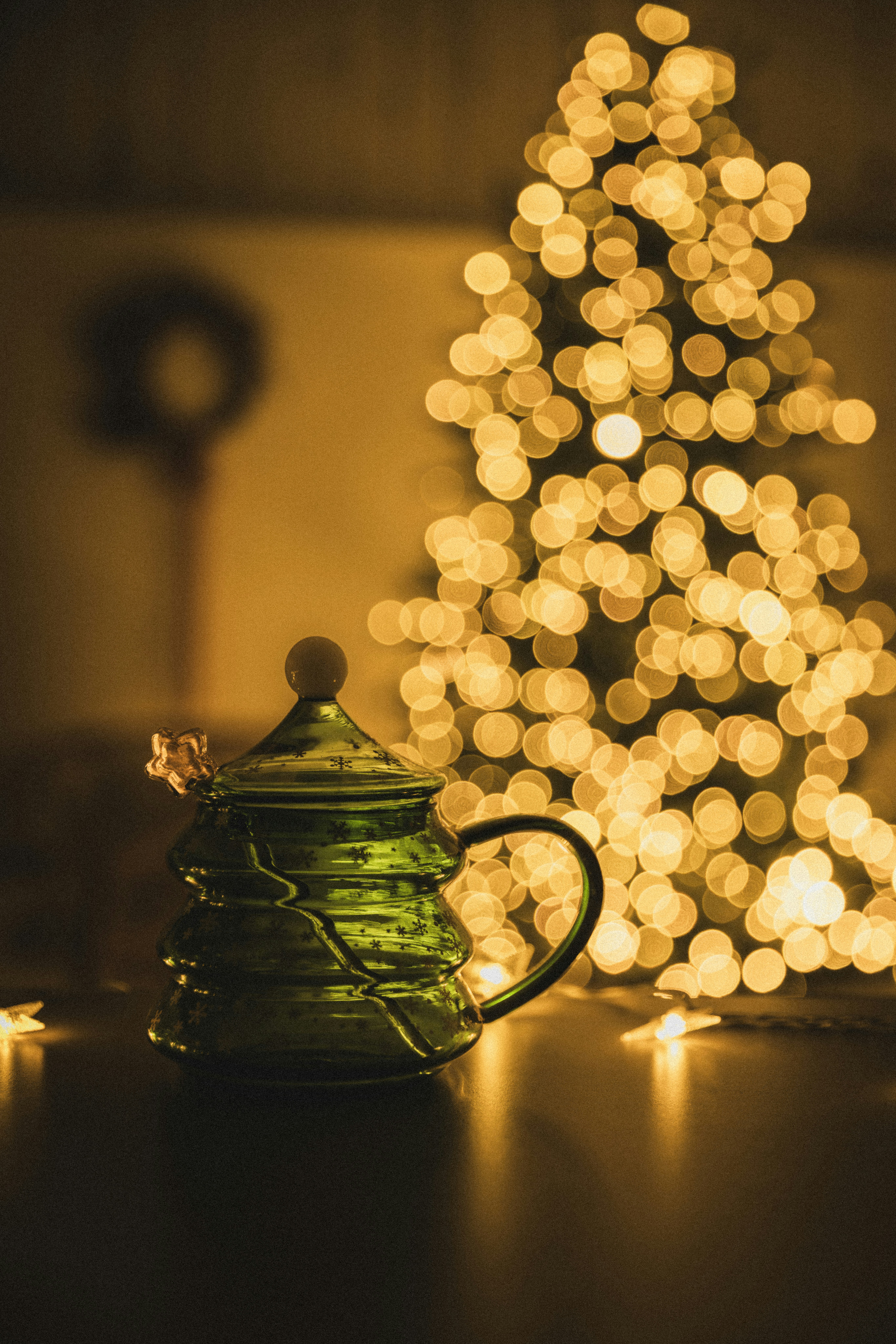 Emerald Teapot Under a Golden Holiday Glow