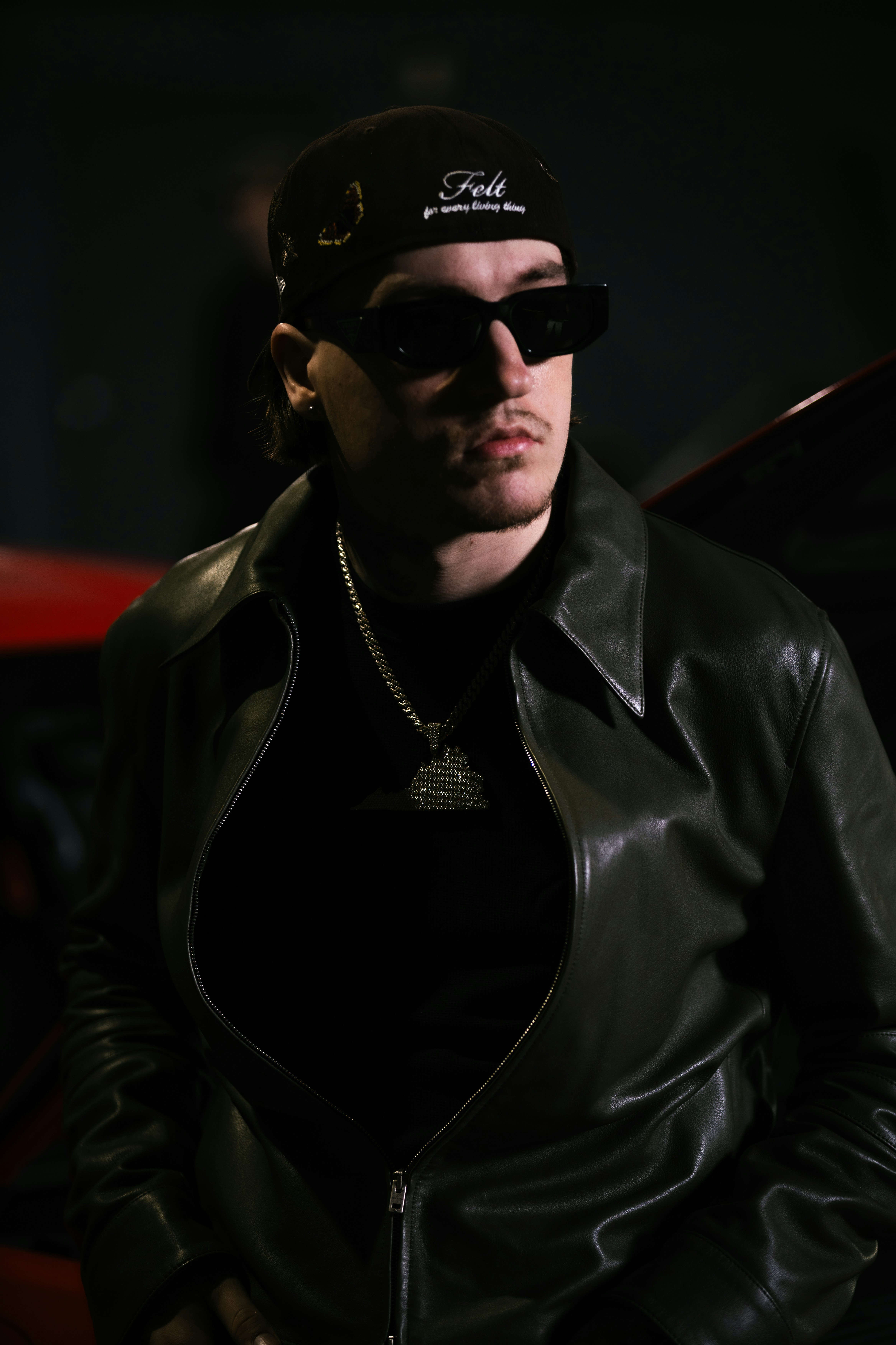Leather Echoes in the Dark: A Quiet Portrait of Confidence