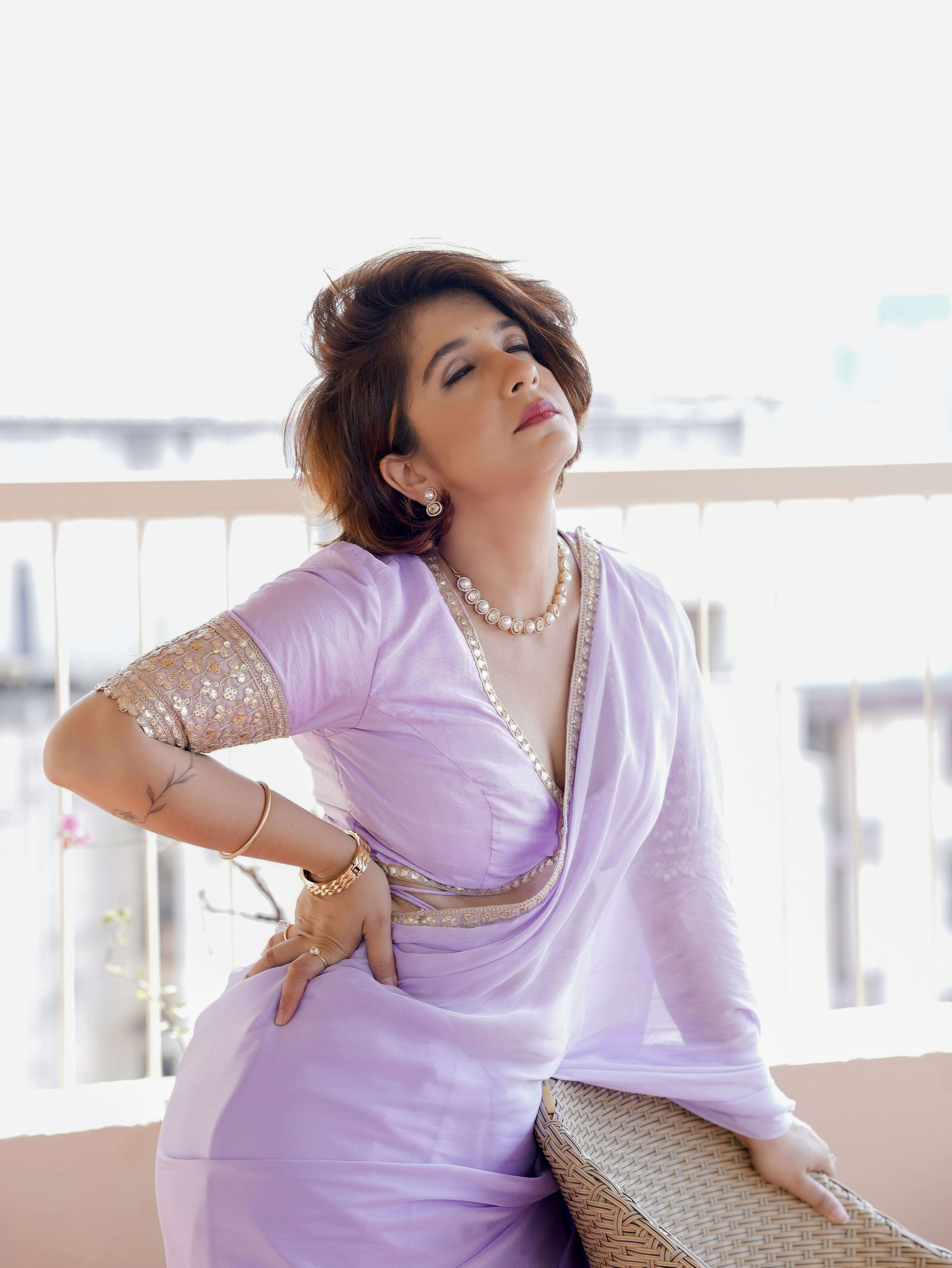Lilac Silk and Pearls: Portrait on a Sunlit Balcony