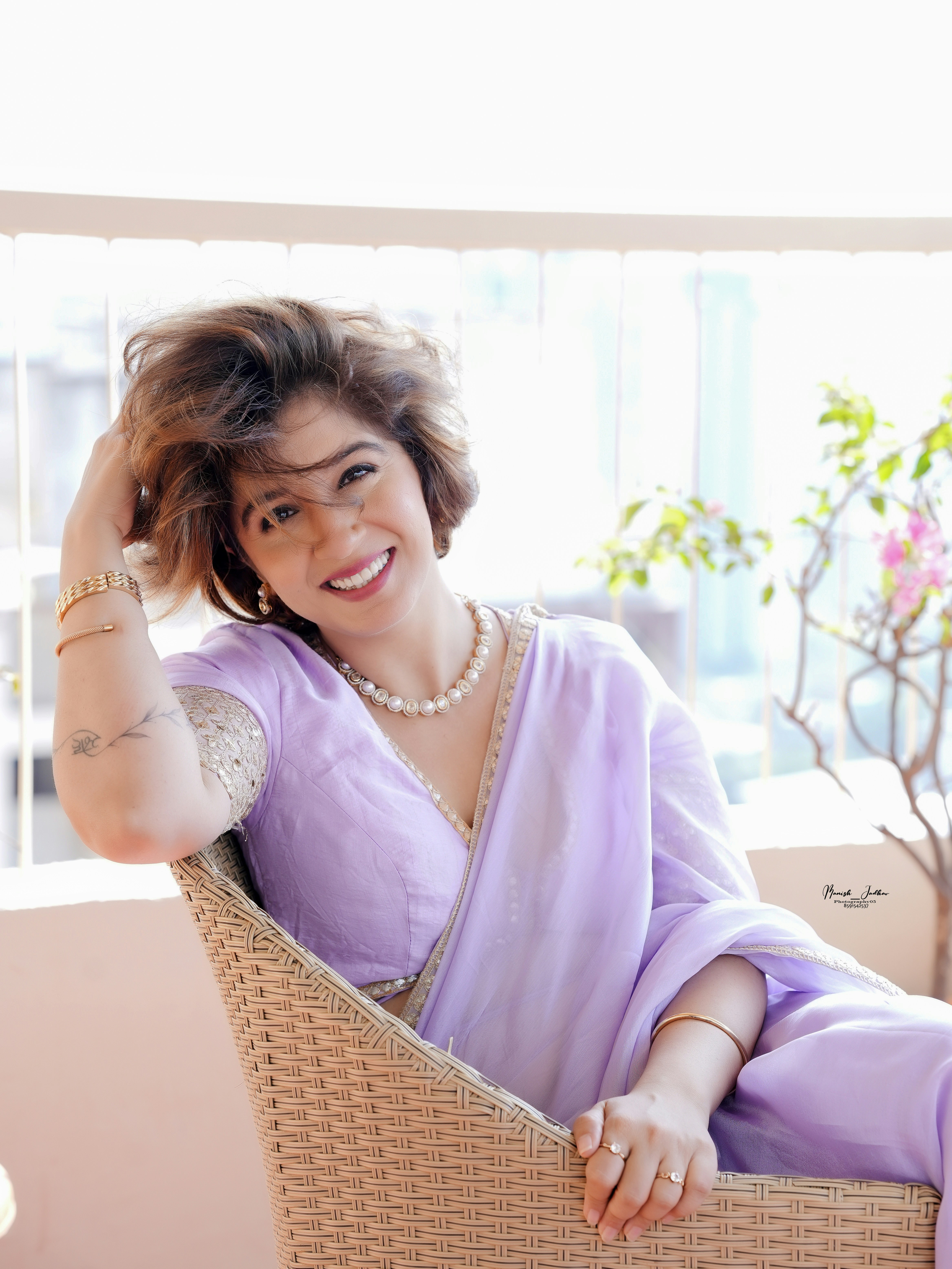 Lavender Balcony Portrait: Sunlit Grace in Wicker Comfort