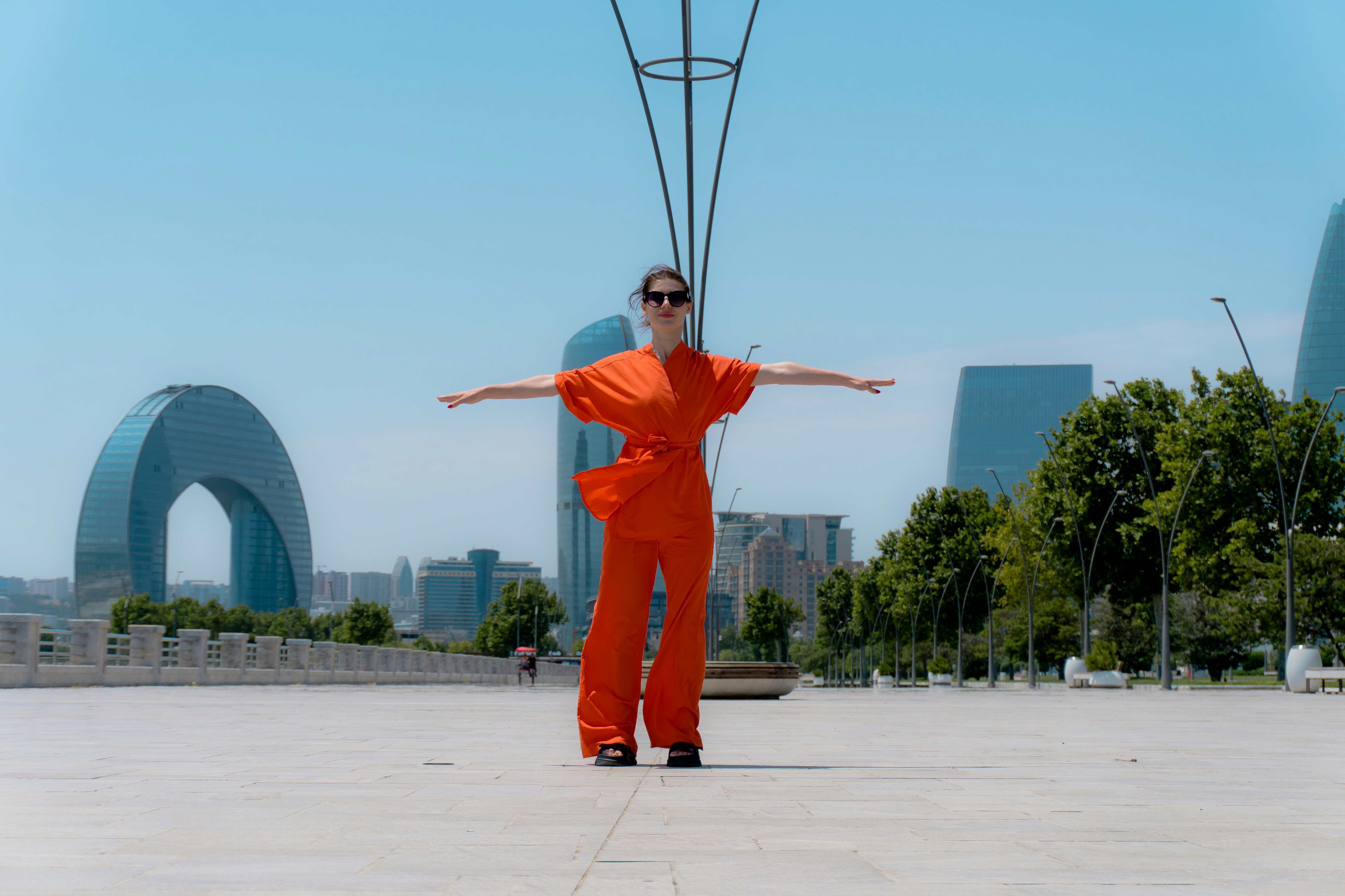 Orange Stance in a Sunlit Urban Oasis