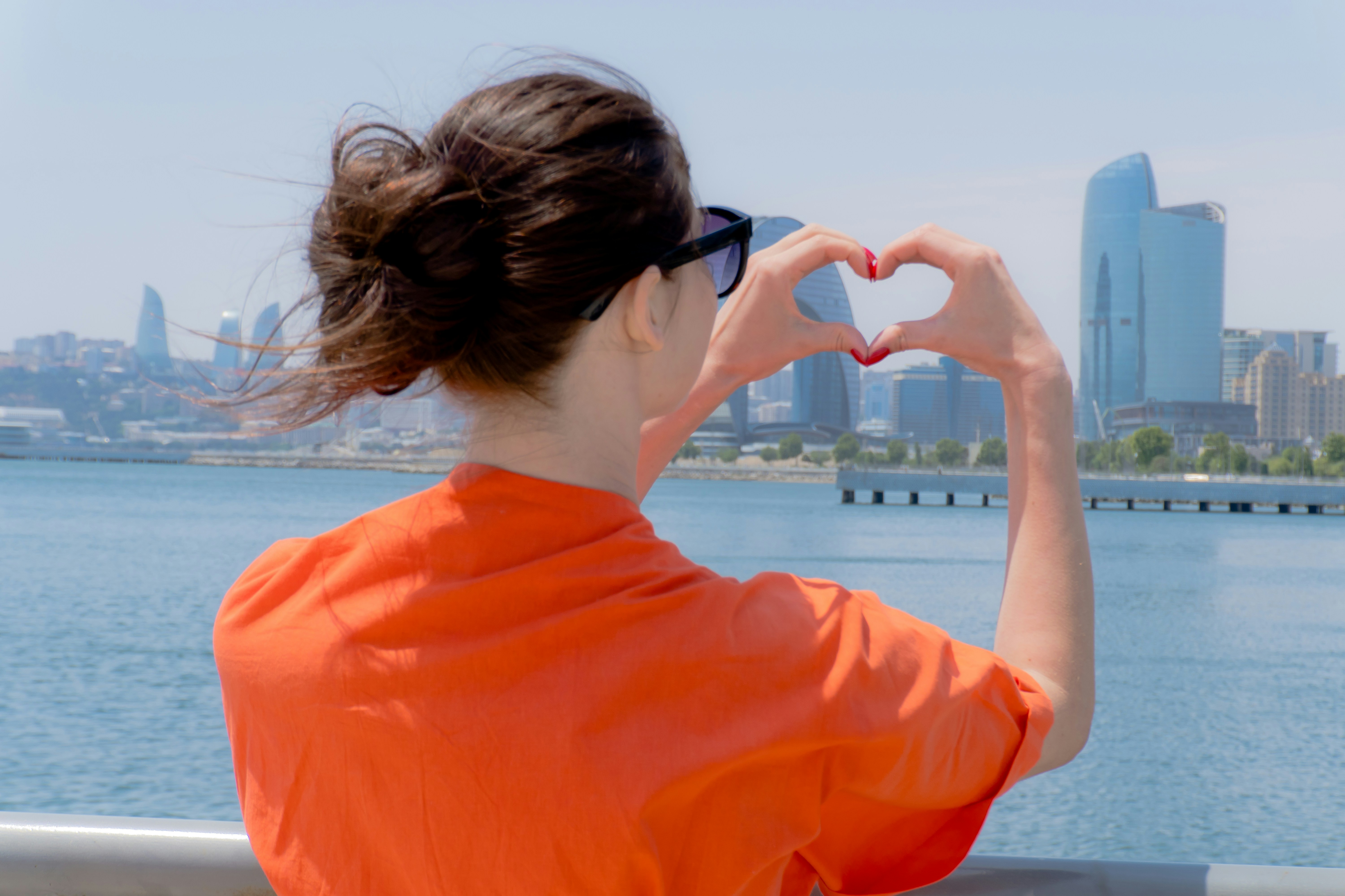 Heart at the Harbor: Hands Form a City-Backed Gesture