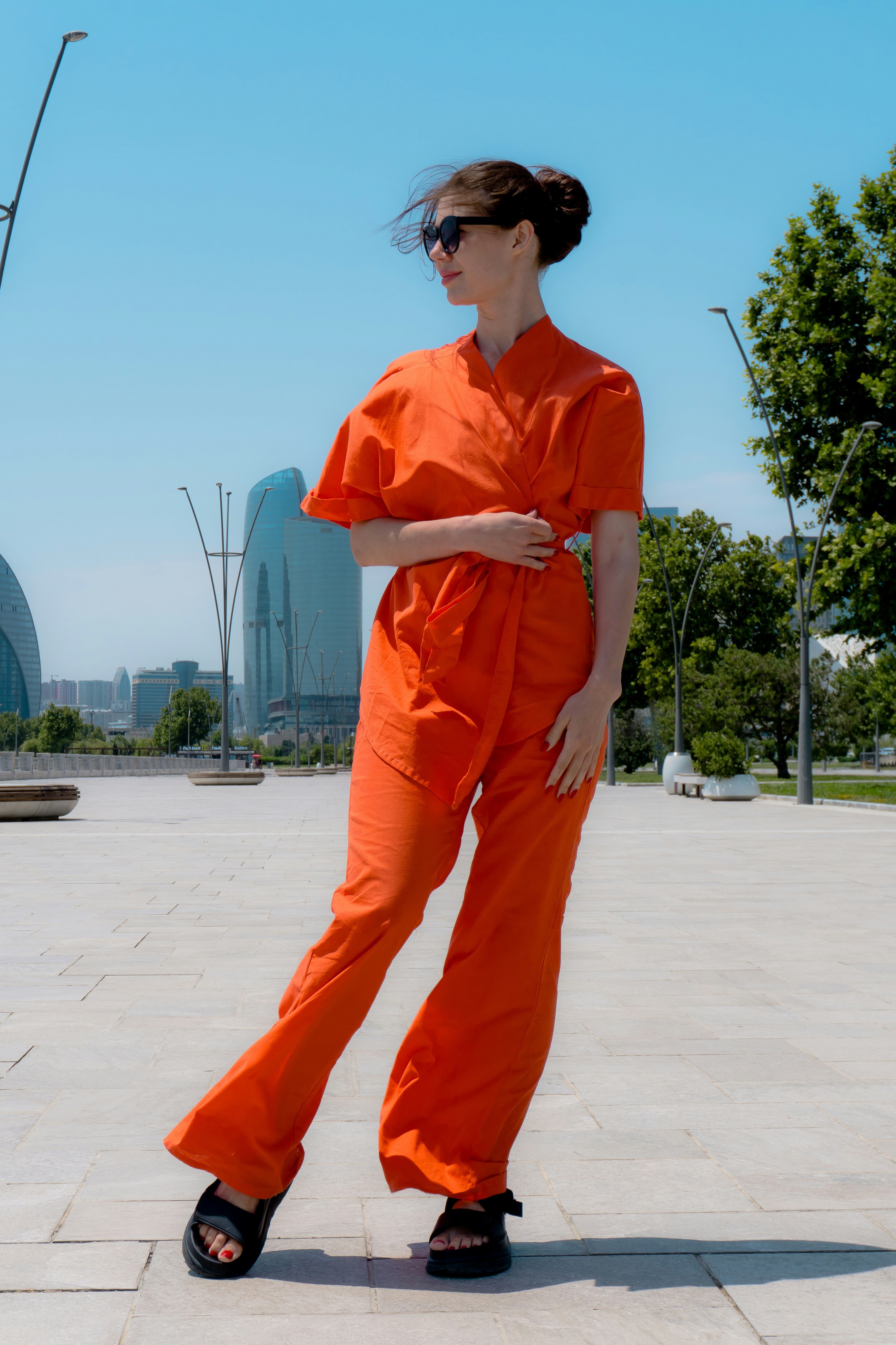 Solar Orange in a City Plaza: A Bold Walk Beneath Glass Giants